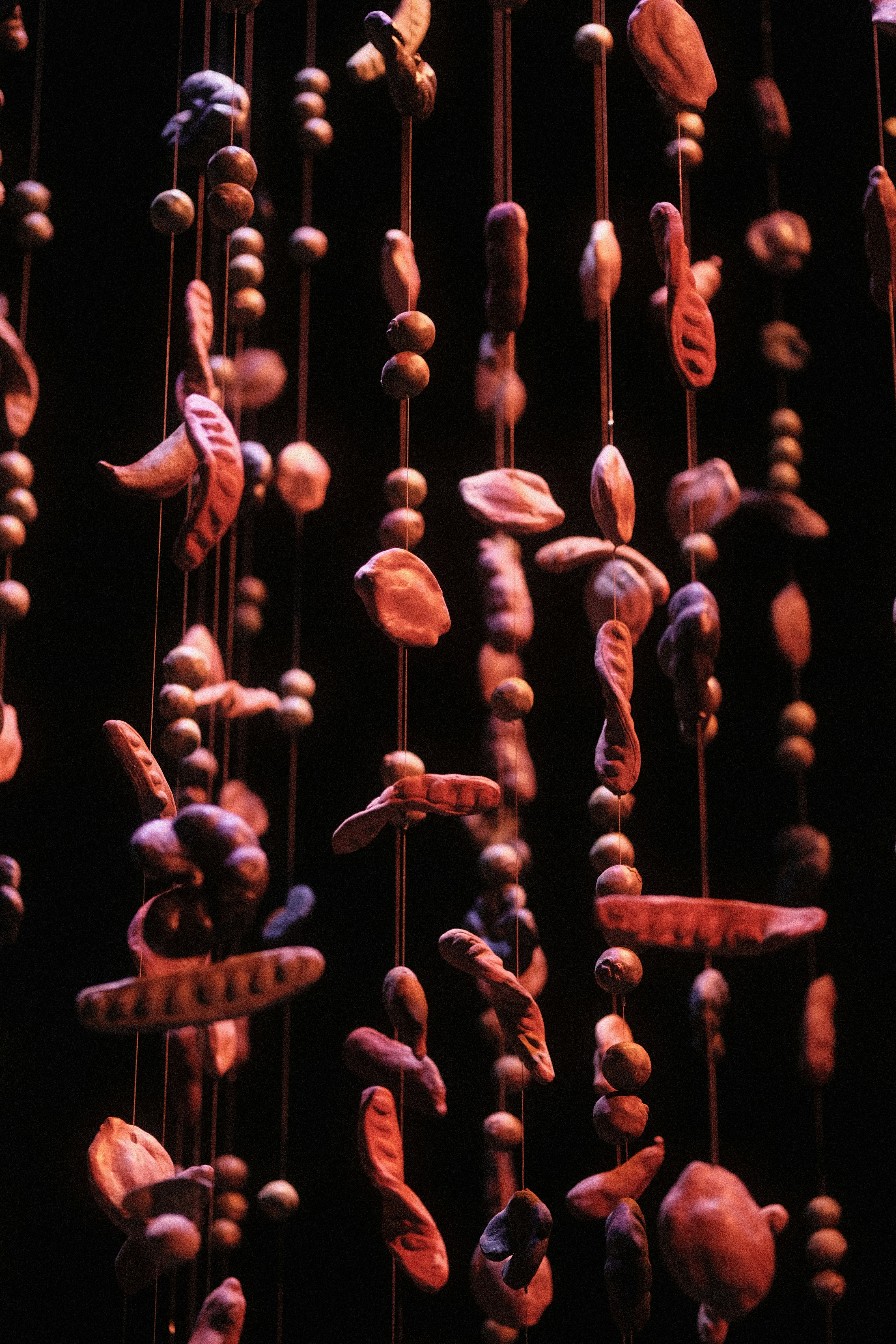Strings of Ember: Bead Curtain in Velvet Light