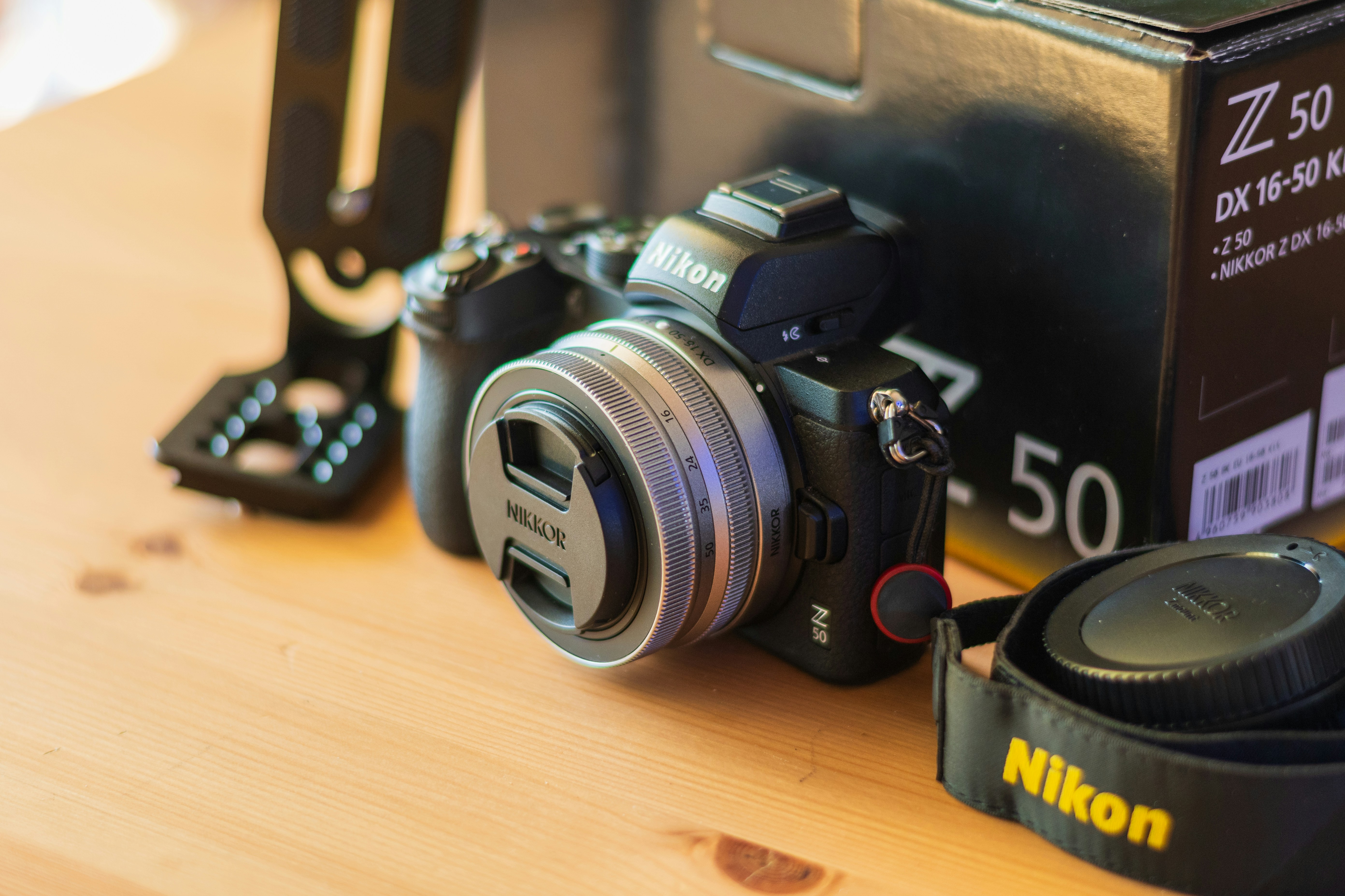 A nikon camera sitting on top of a wooden table photo – Free Madrid ...