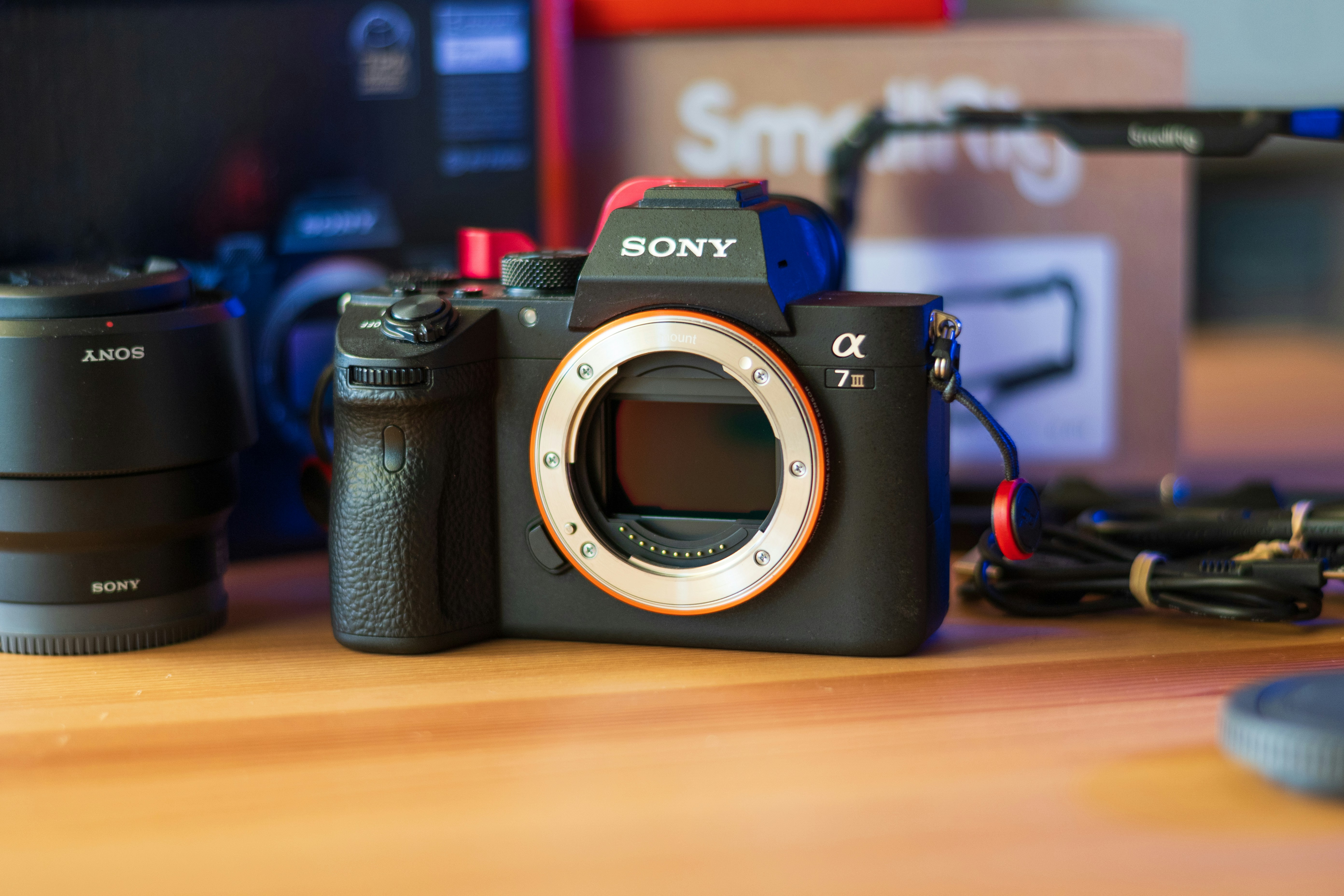 Open Lens, Closed Possibilities: A Sony Alpha on a Wooden Stage