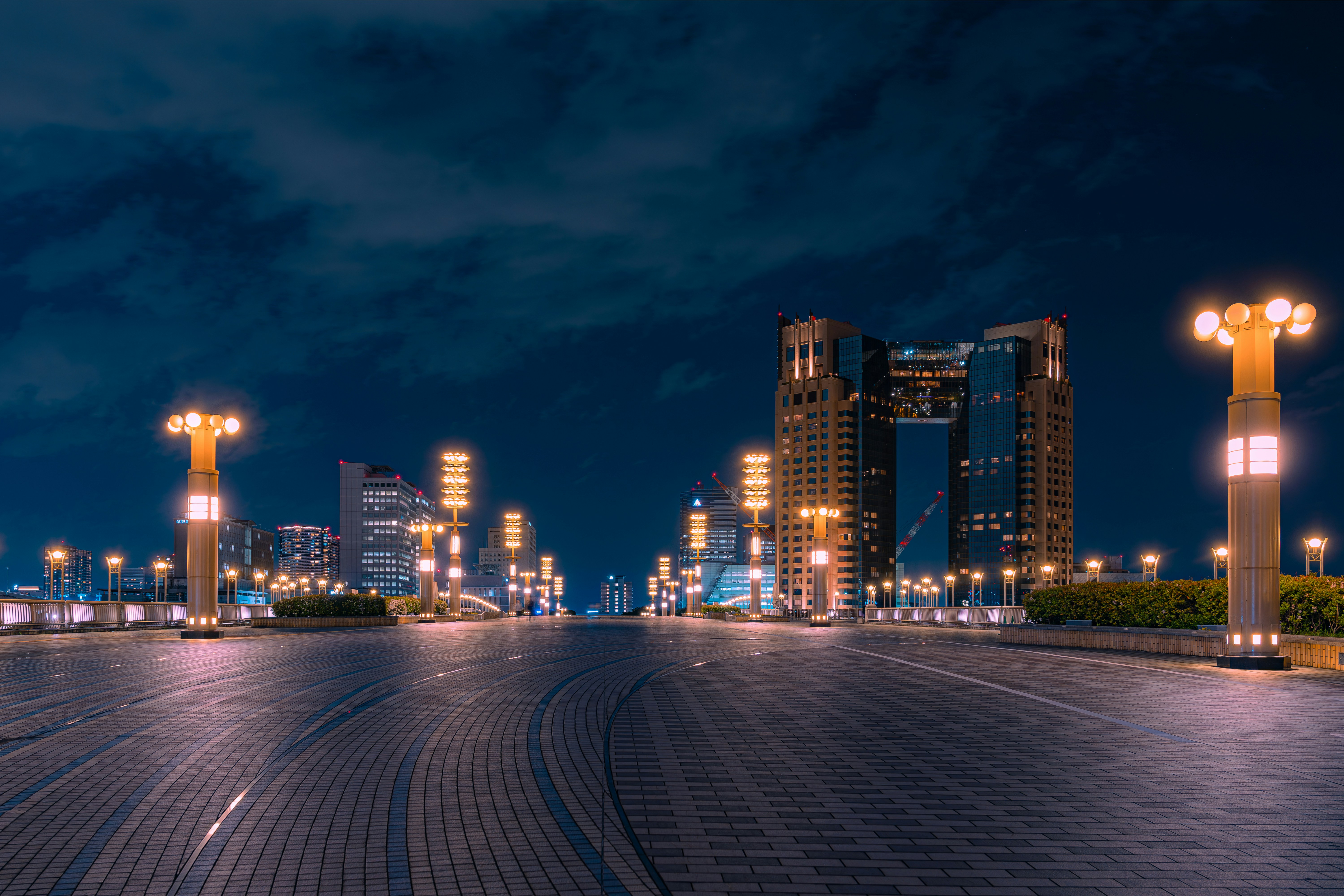 A city street at night with a lot of lights photo – Free Building Image ...