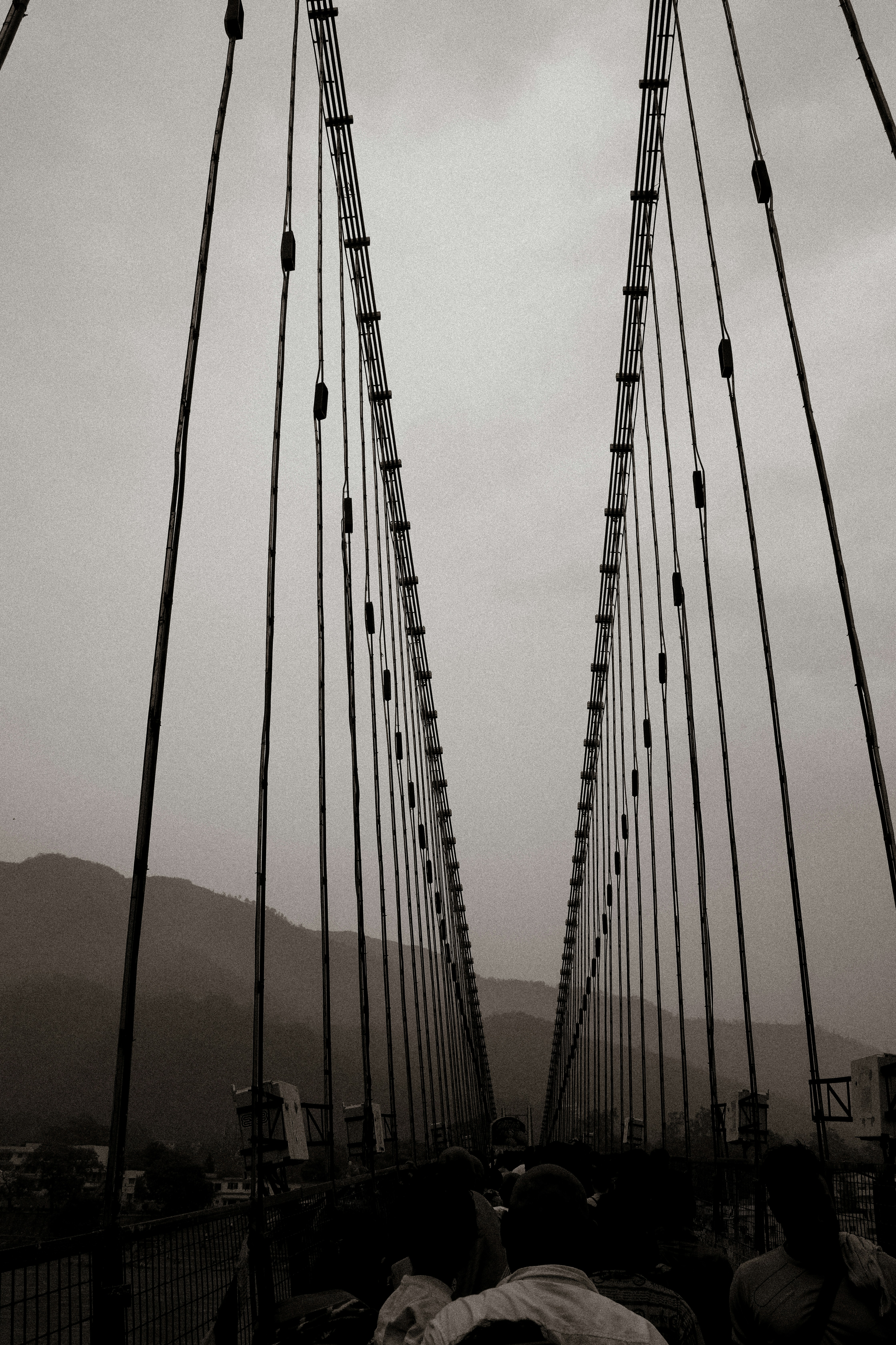 Vanishing Lines: A Monochrome Walk Across a Suspended Bridge