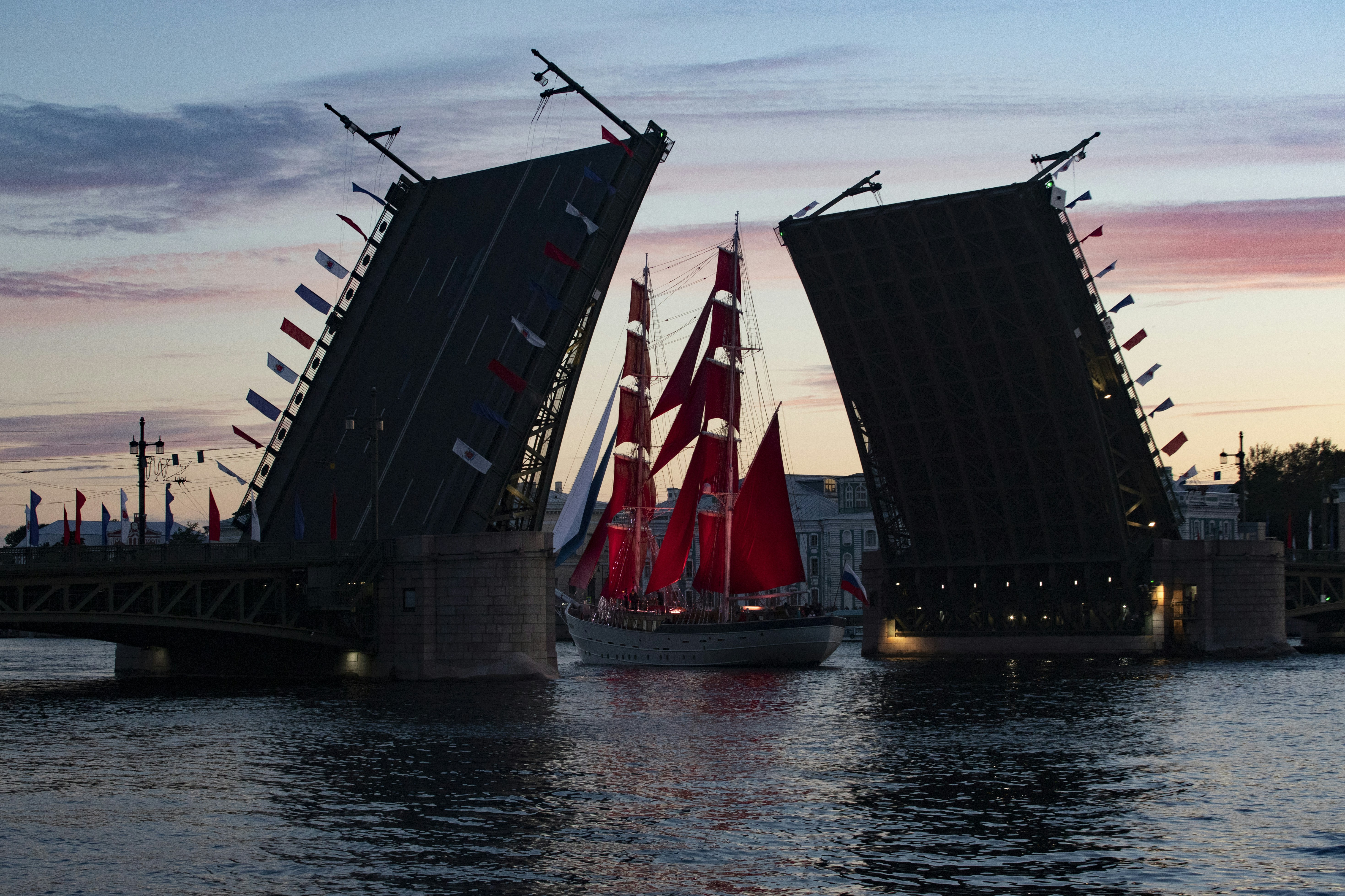 Two ships are sailing in the water near a bridge photo – Free Event ...