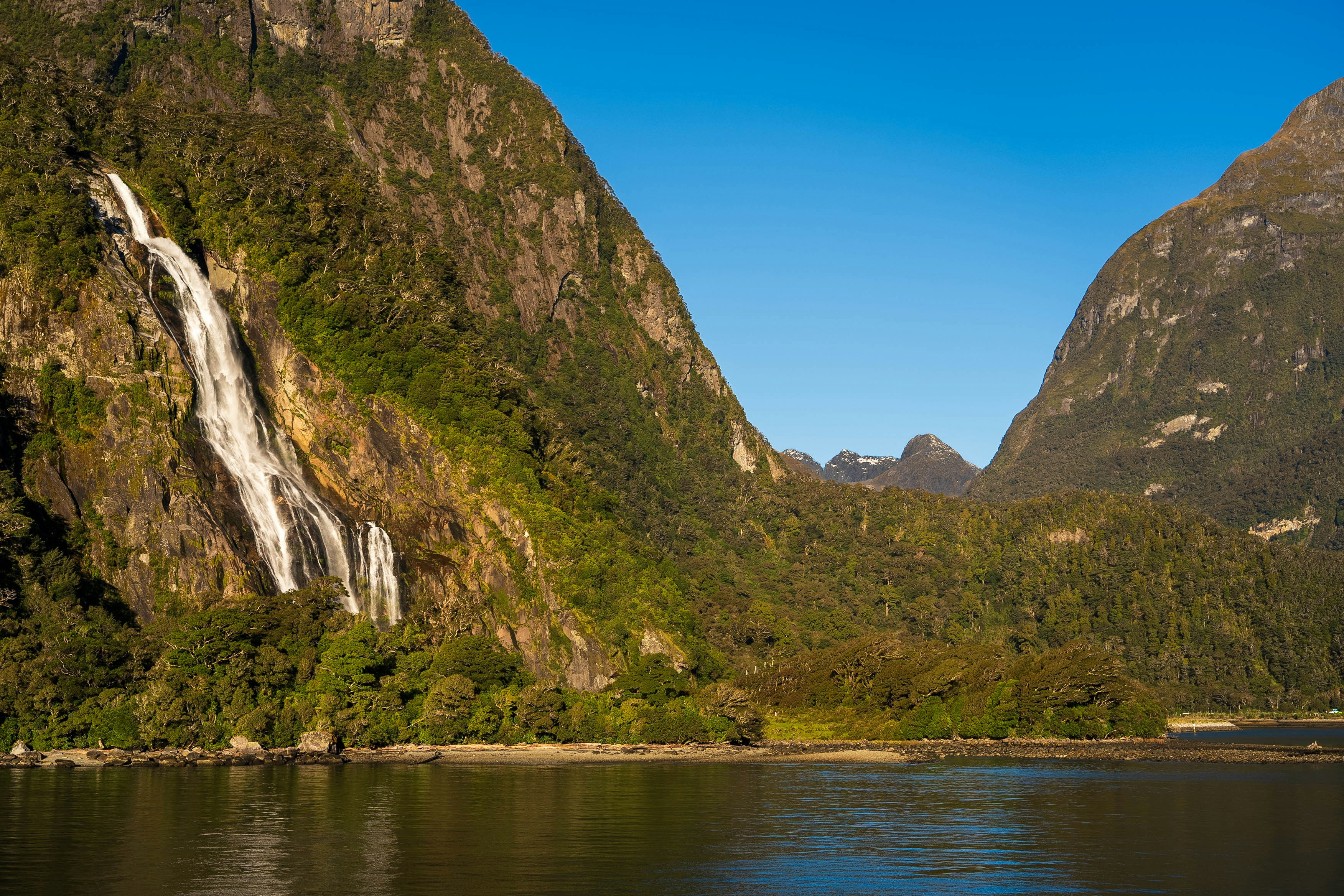 Cascade Overlook: Towering Fjord cliffs and a Falling Veil