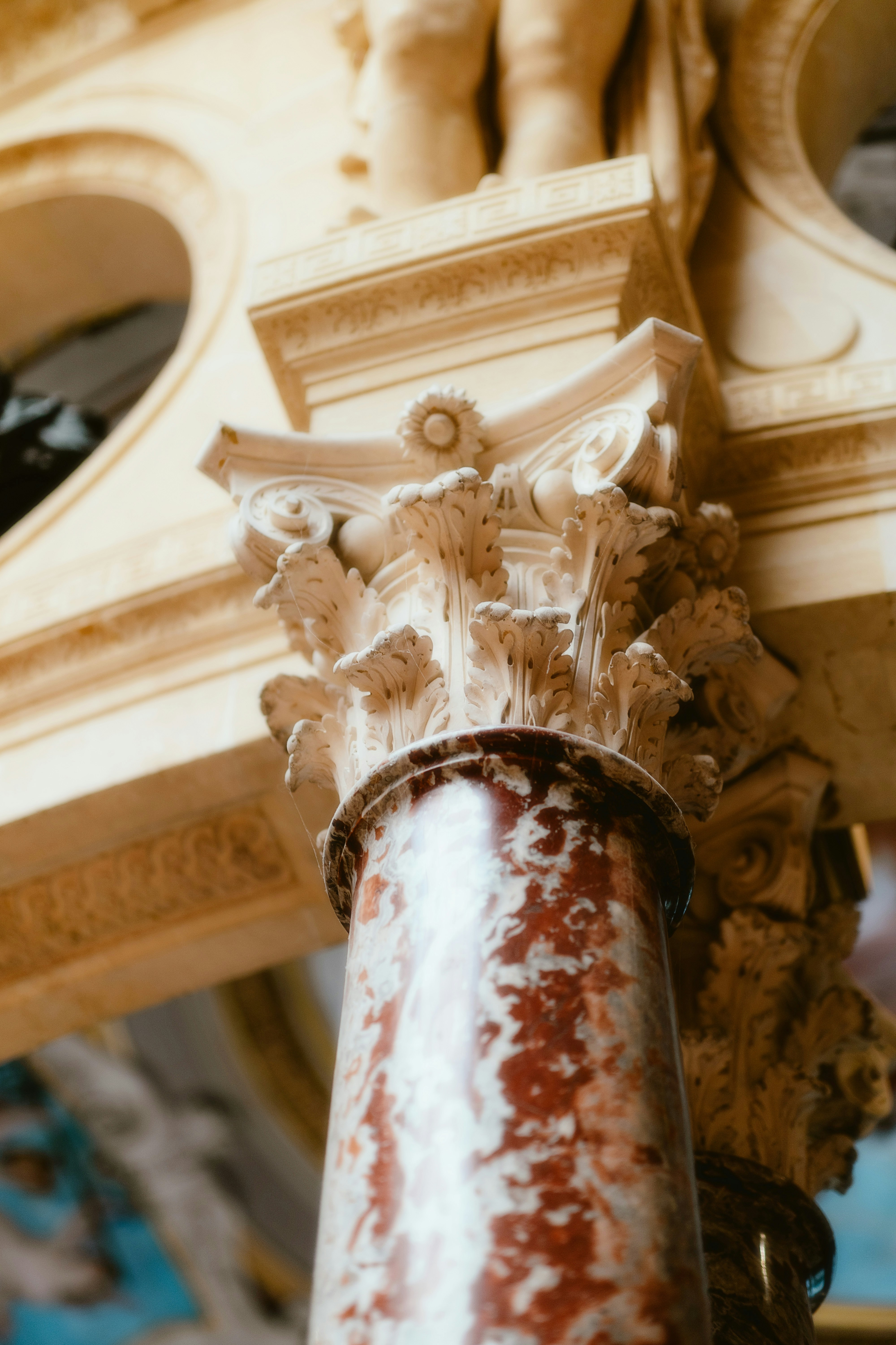 Crimson-veined Marble Column: A Portrait of Ornate Architectural Craft