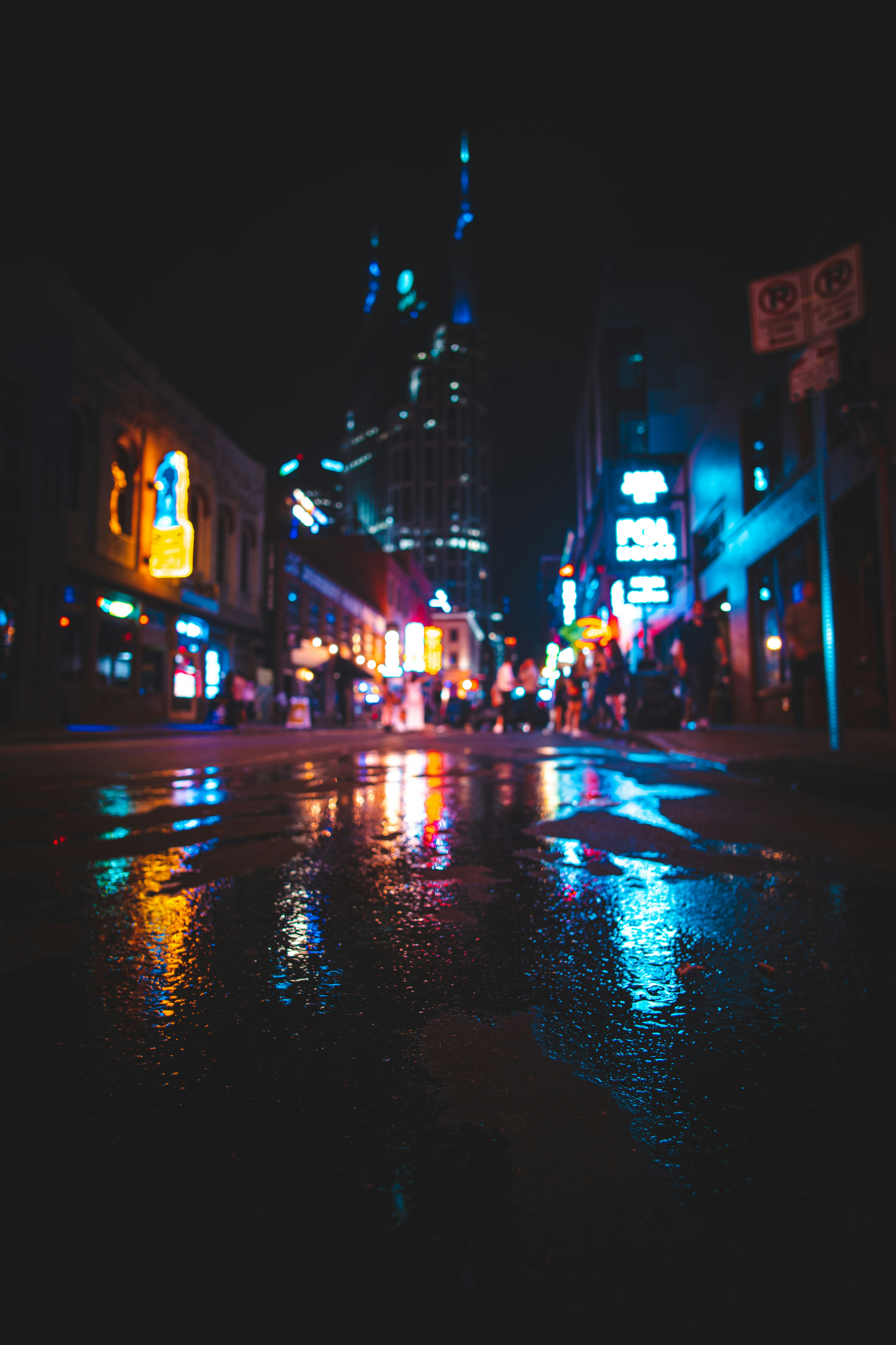A city street at night with a lot of lights photo – Free Building Image ...