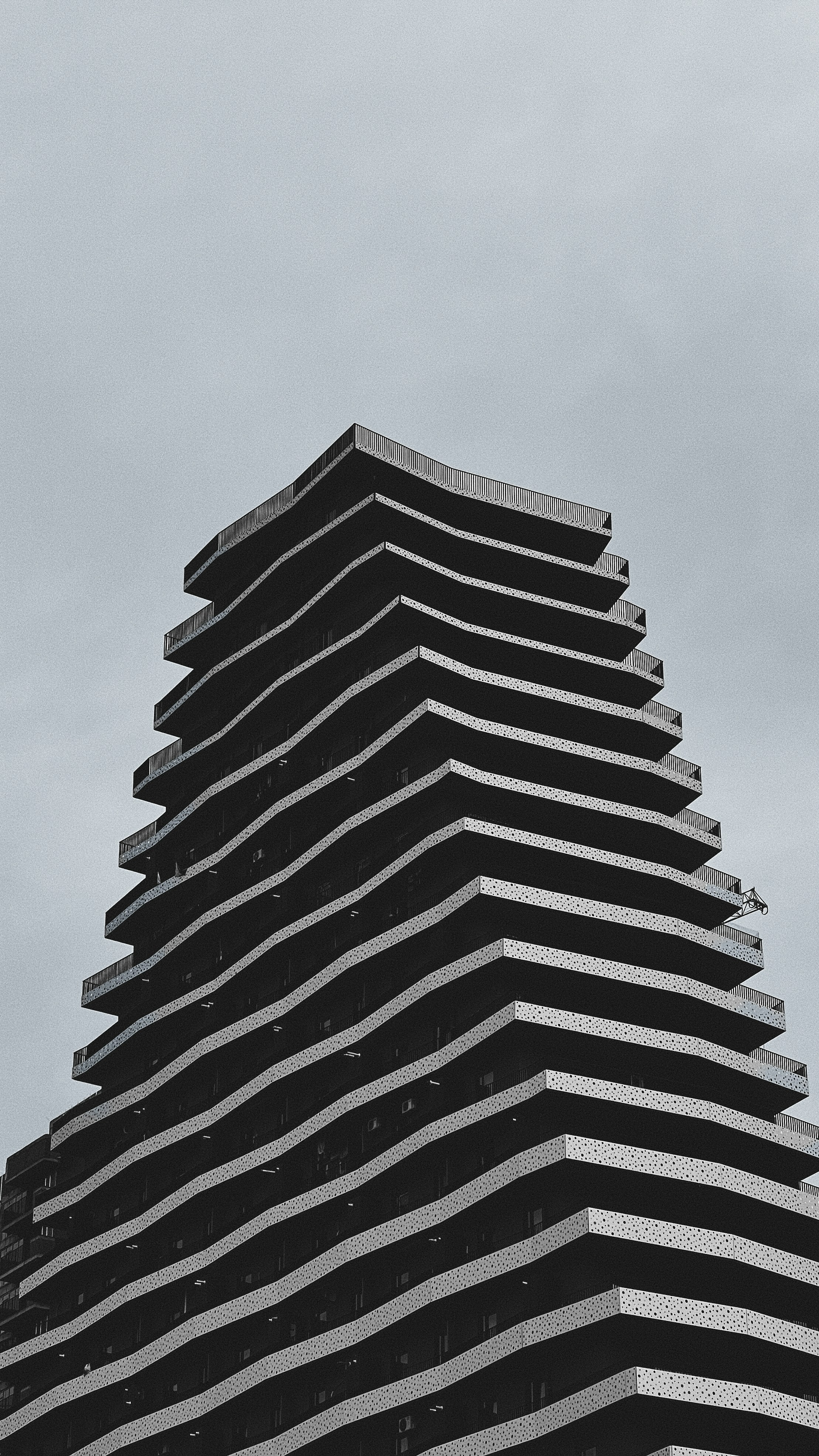 Tiered Monolith Reaching for Grey Skies
