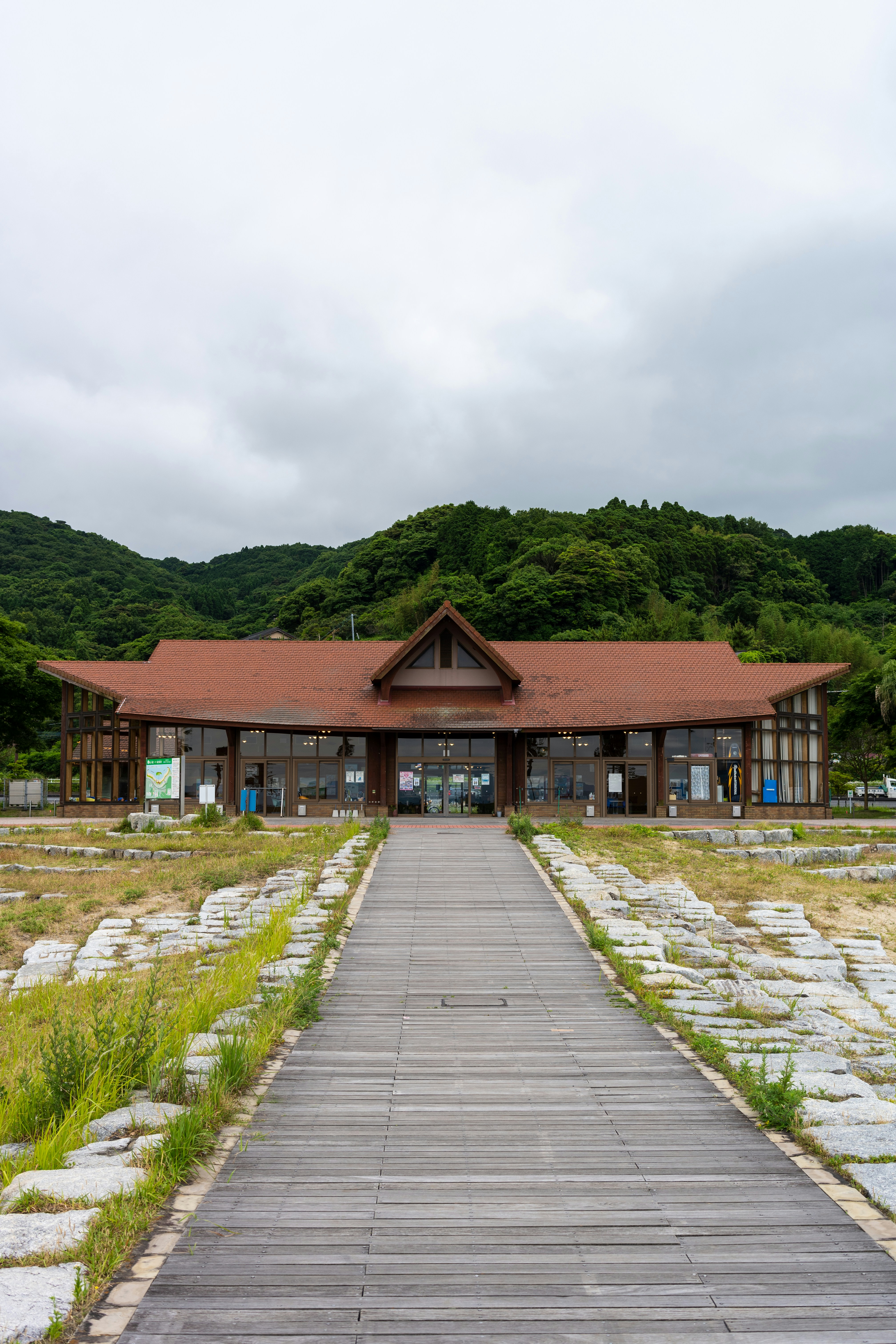 Red-Roofed Lodge at the End of a Wooden Walkway