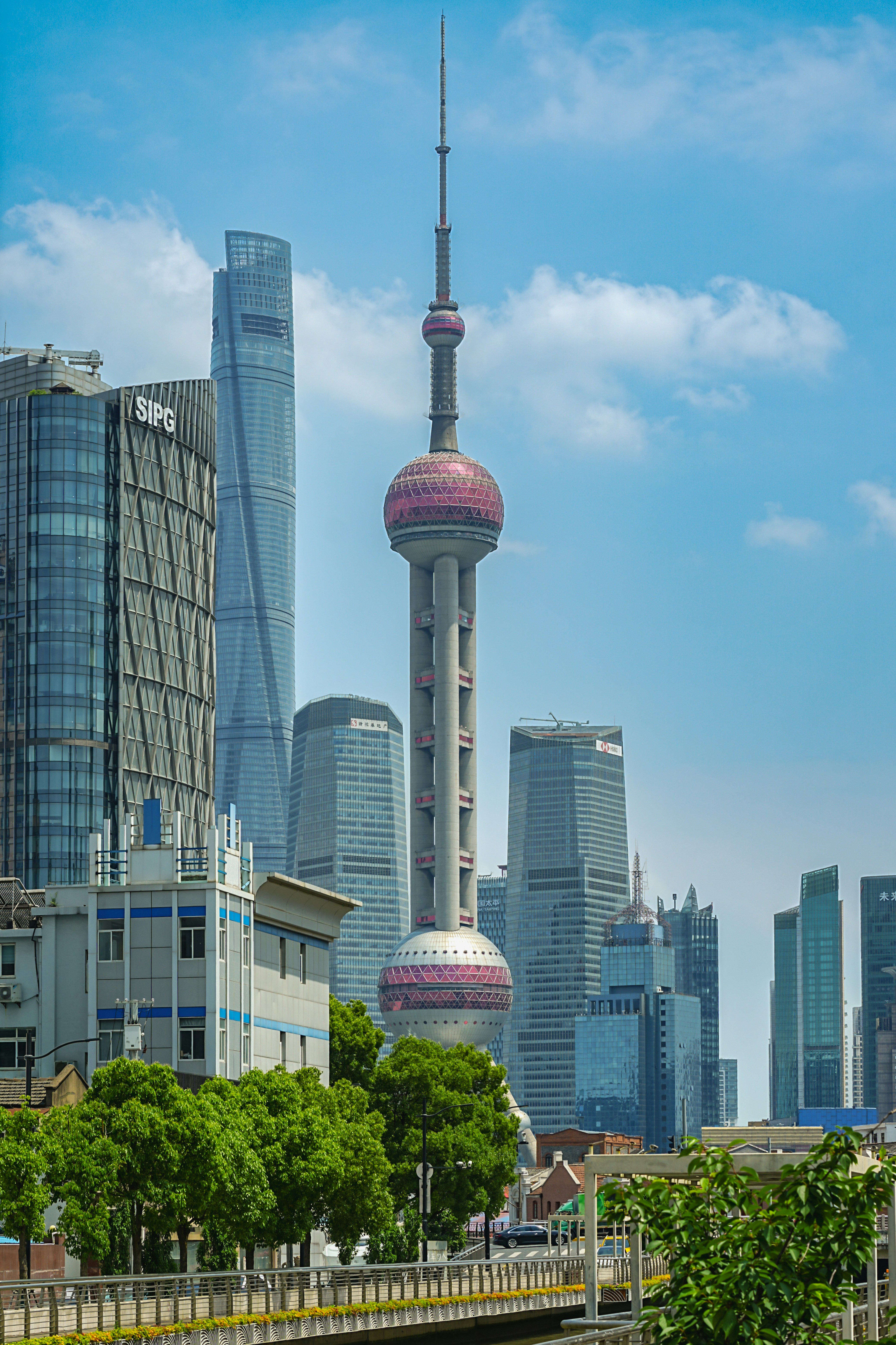 a view of a city skyline with a bridge in the foreground