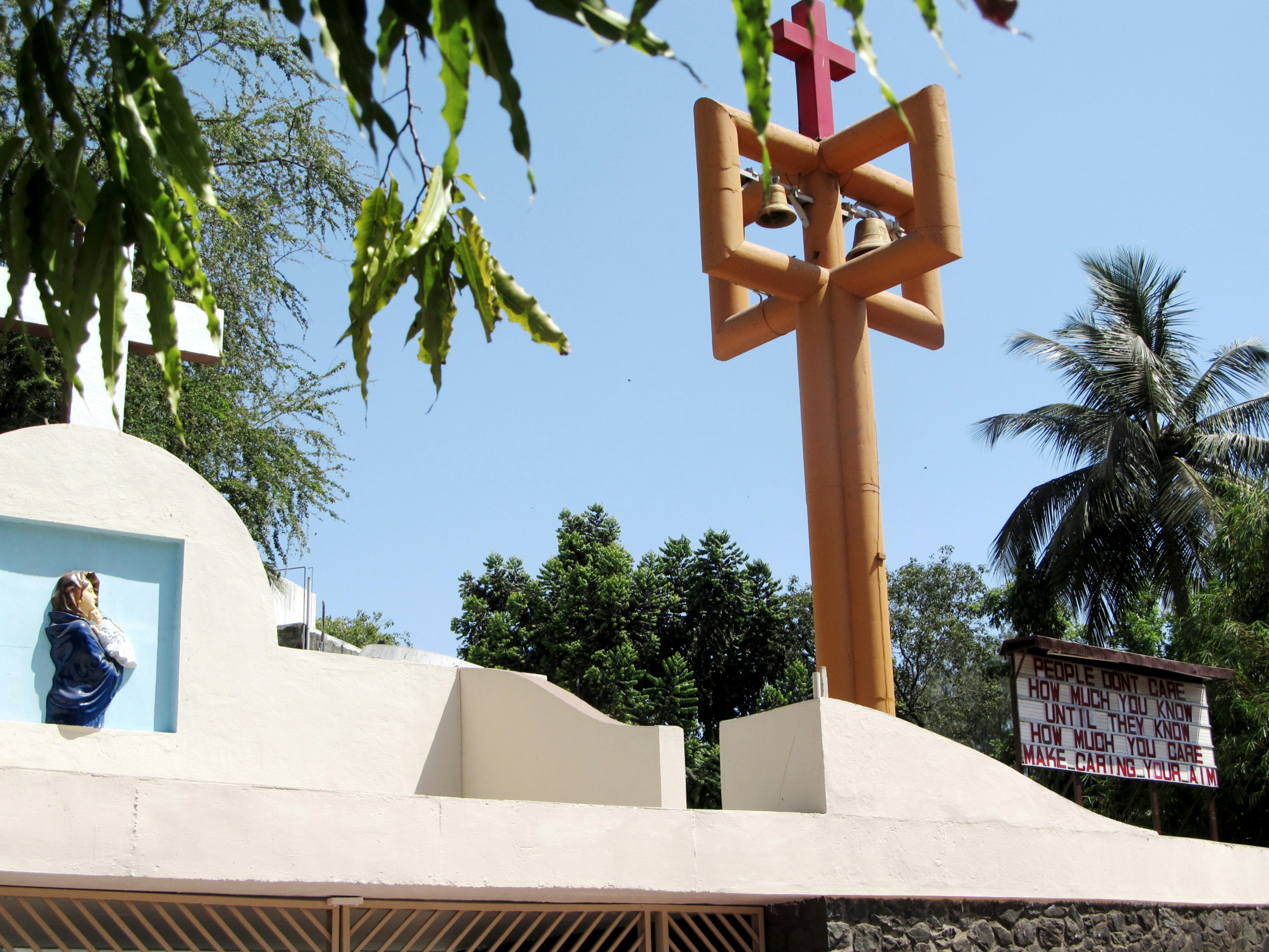 A large wooden cross on top of a building photo – Free Human Image on ...