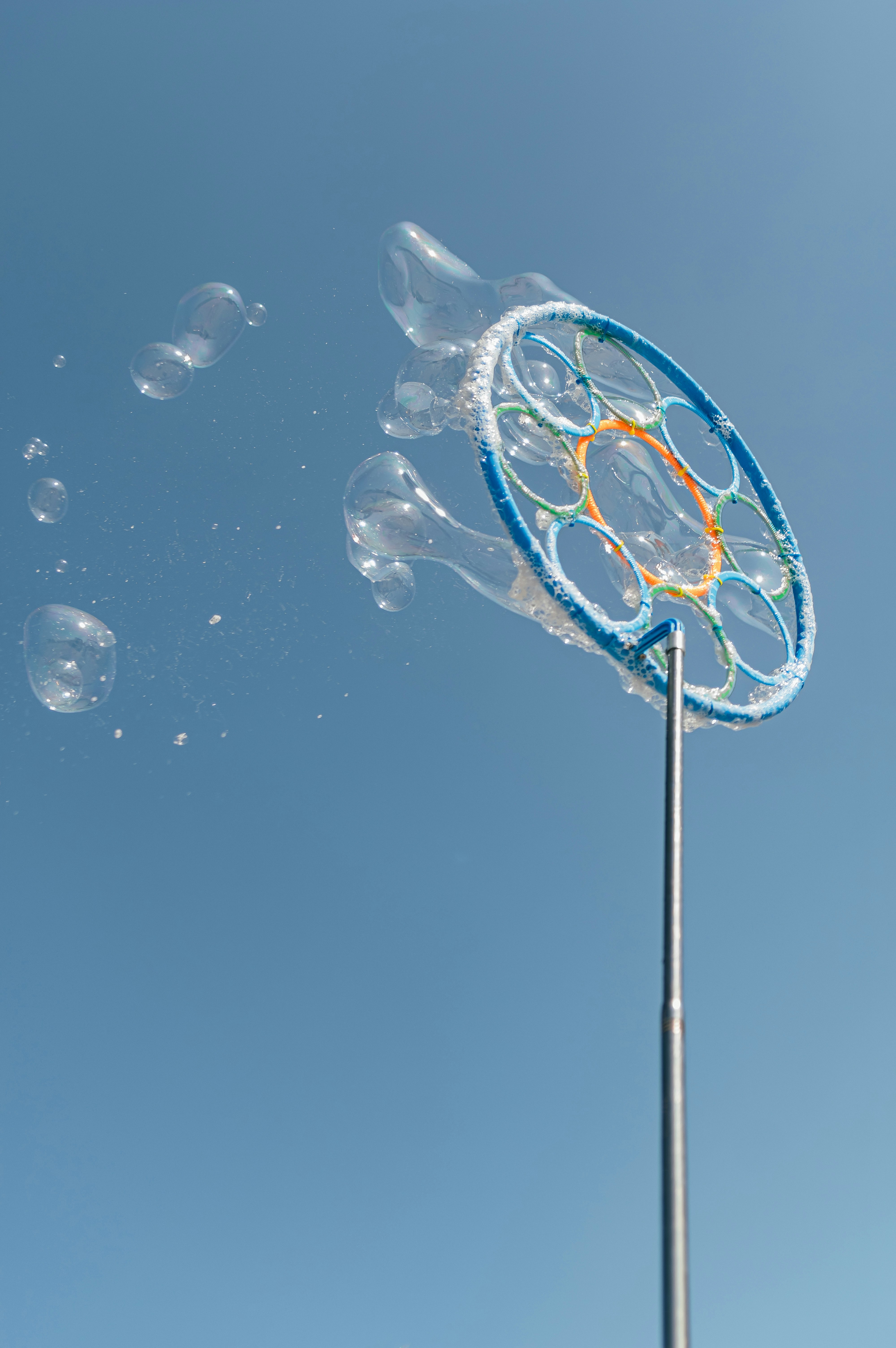 A street light with bubbles coming out of it photo – Free Soap bubble ...