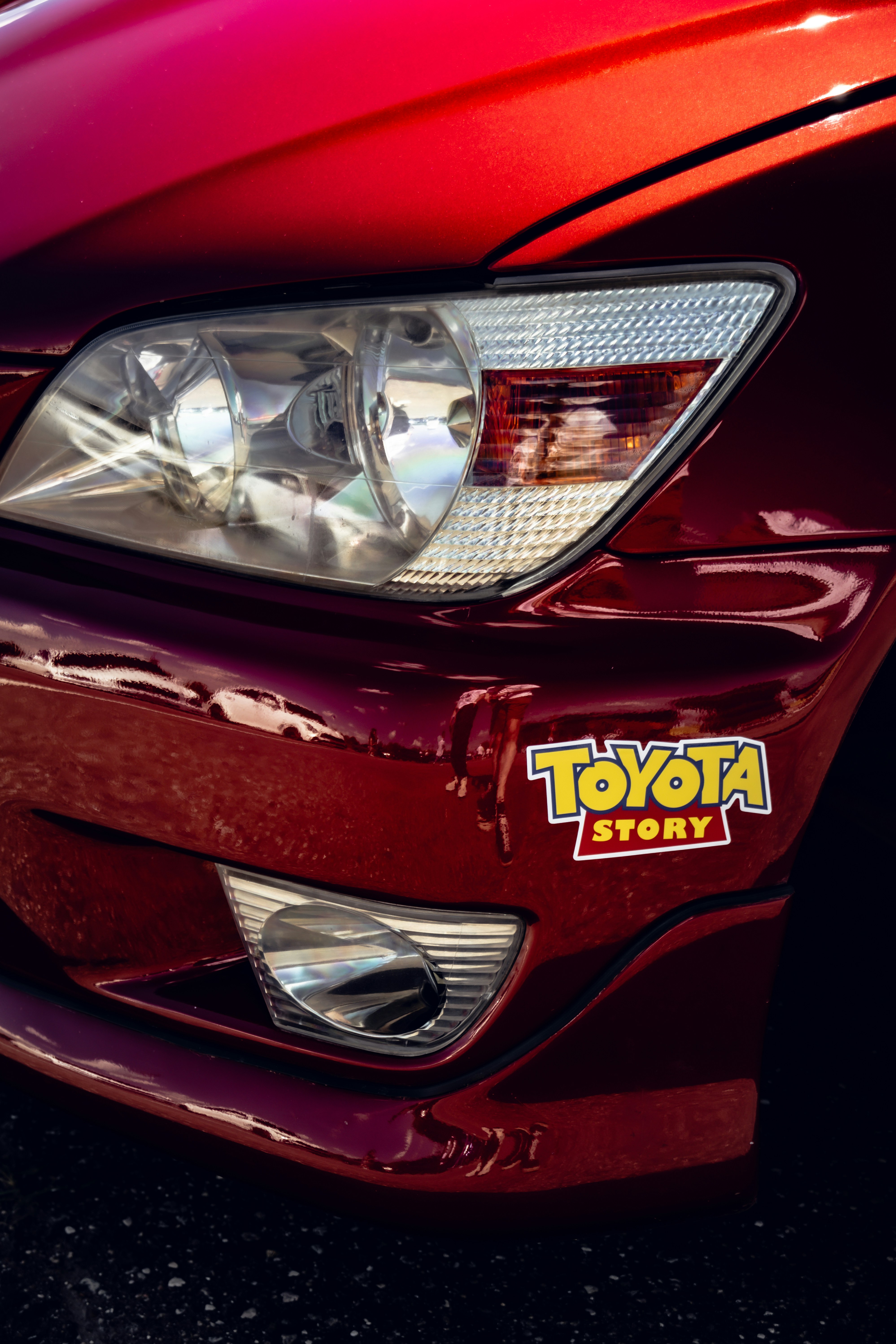 A close up of a red car with a toy story sticker on it photo – Free Car ...