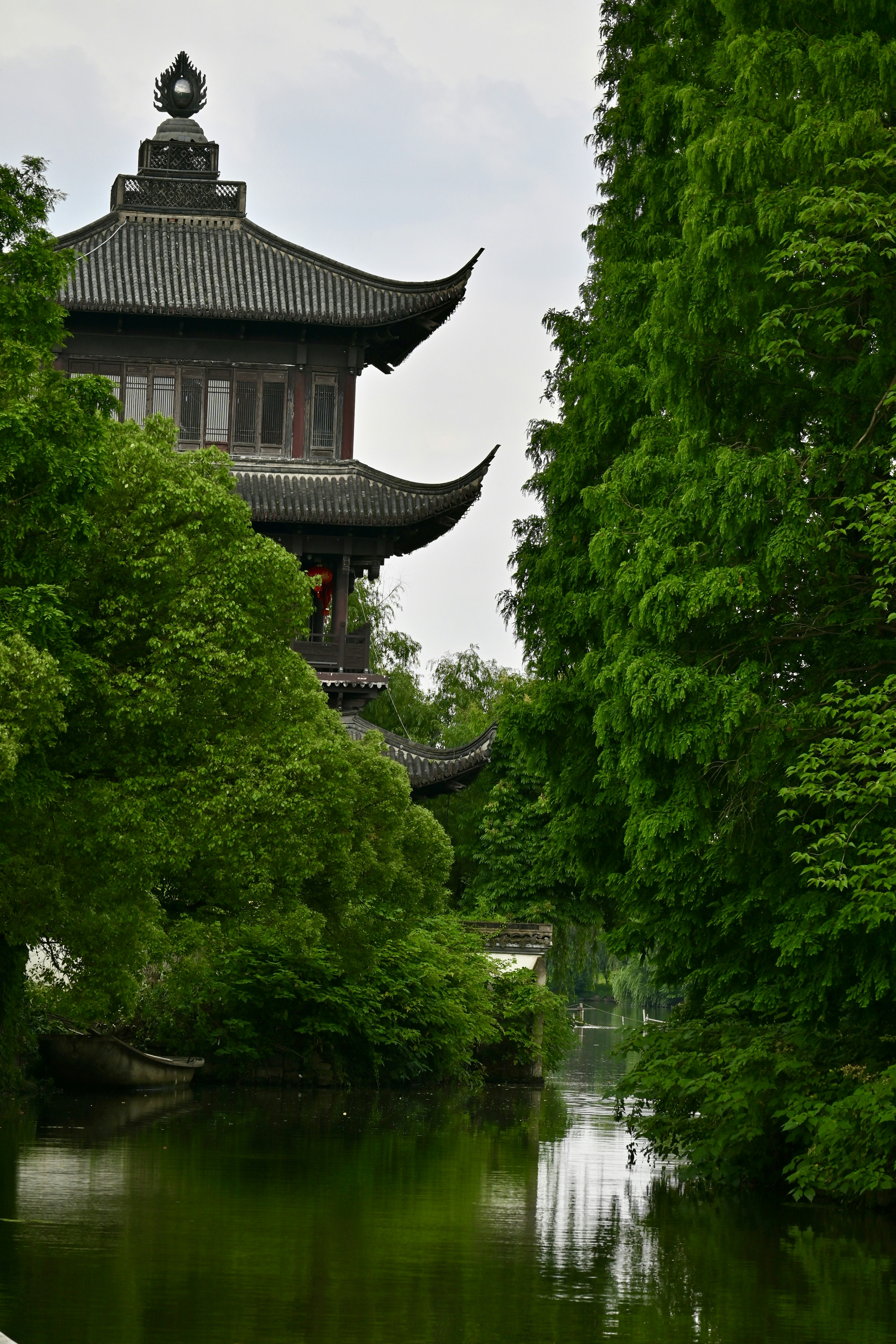 Verdant Canal Pagoda: A Quiet Frame of Green and Stone