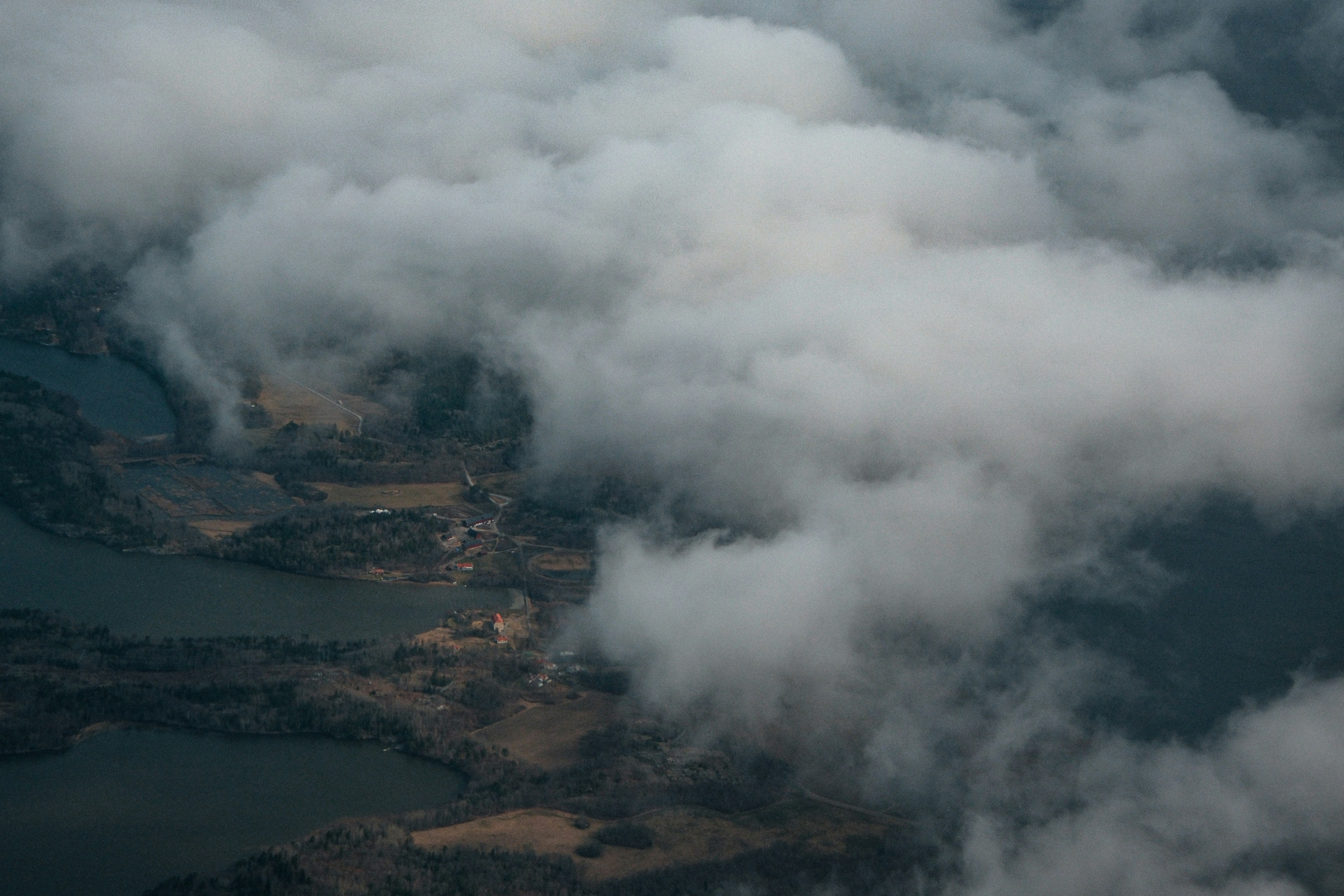 Mist-Sheathed Coastline: Cloud Veils over Winding Inland Lakes