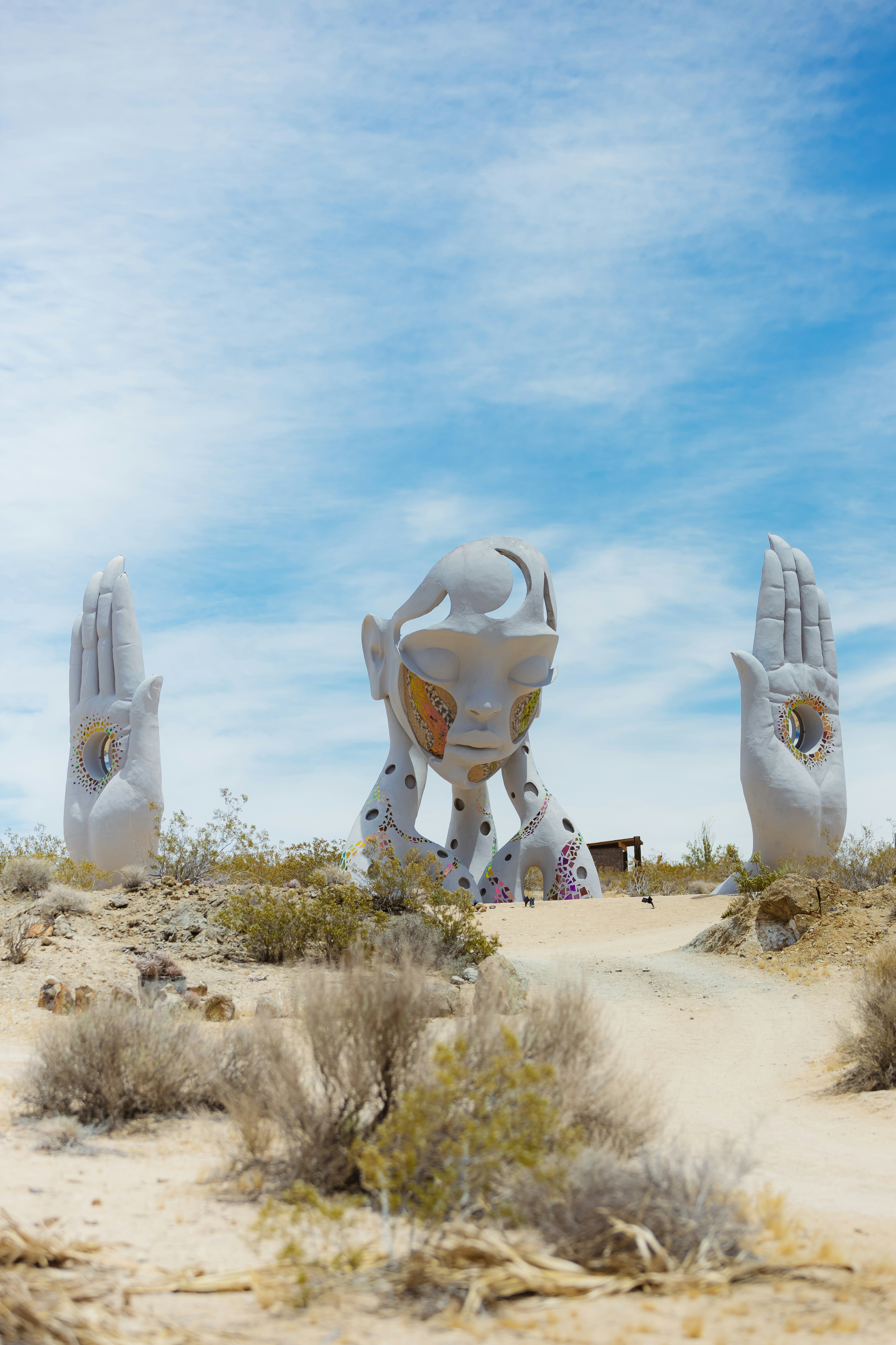 A group of giant hand sculptures in the middle of a desert photo – Free ...