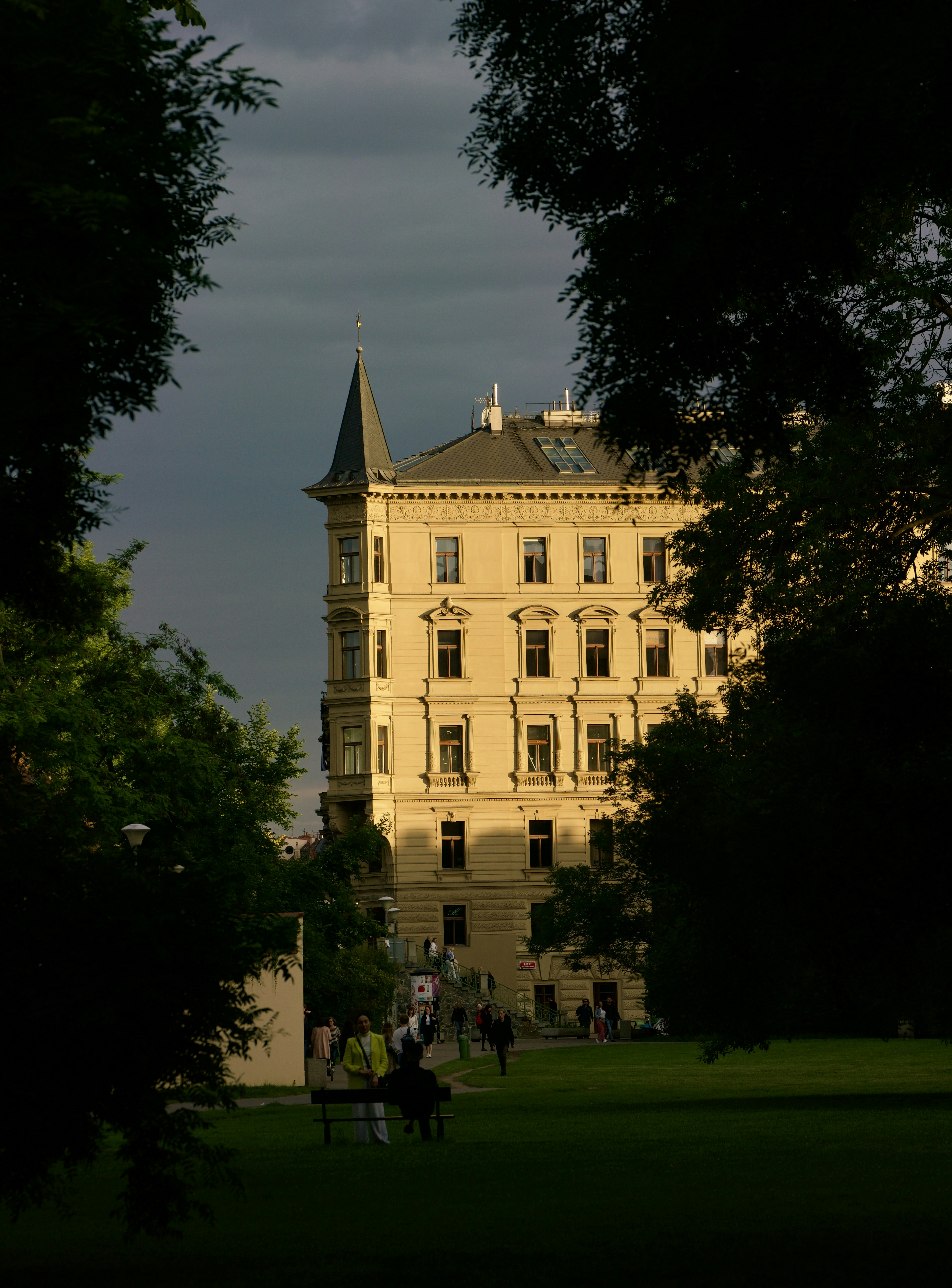 Golden Facade Framed by Park Shade: Beaux-Arts Grandeur
