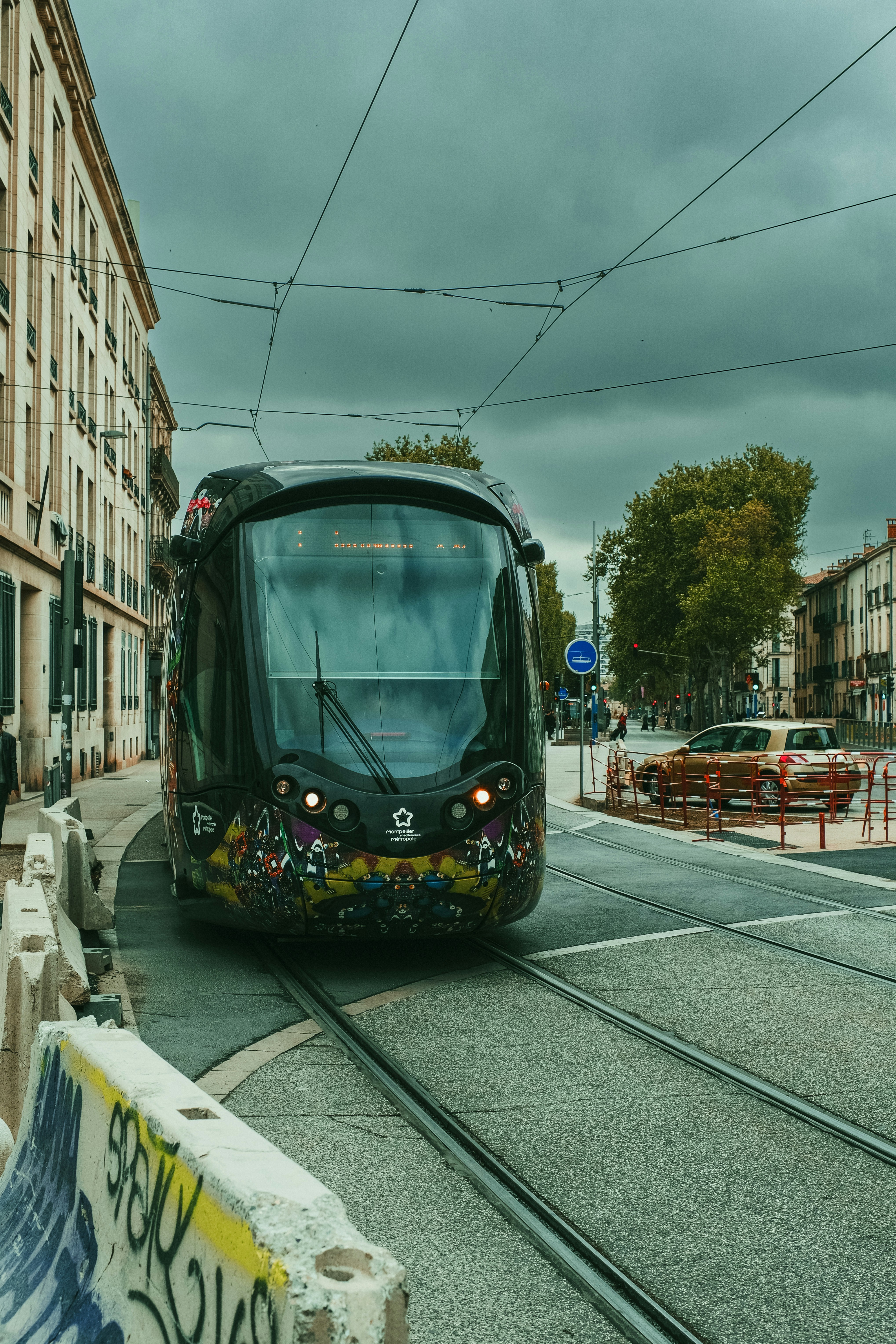 Montpellier's tramway with a dark sky