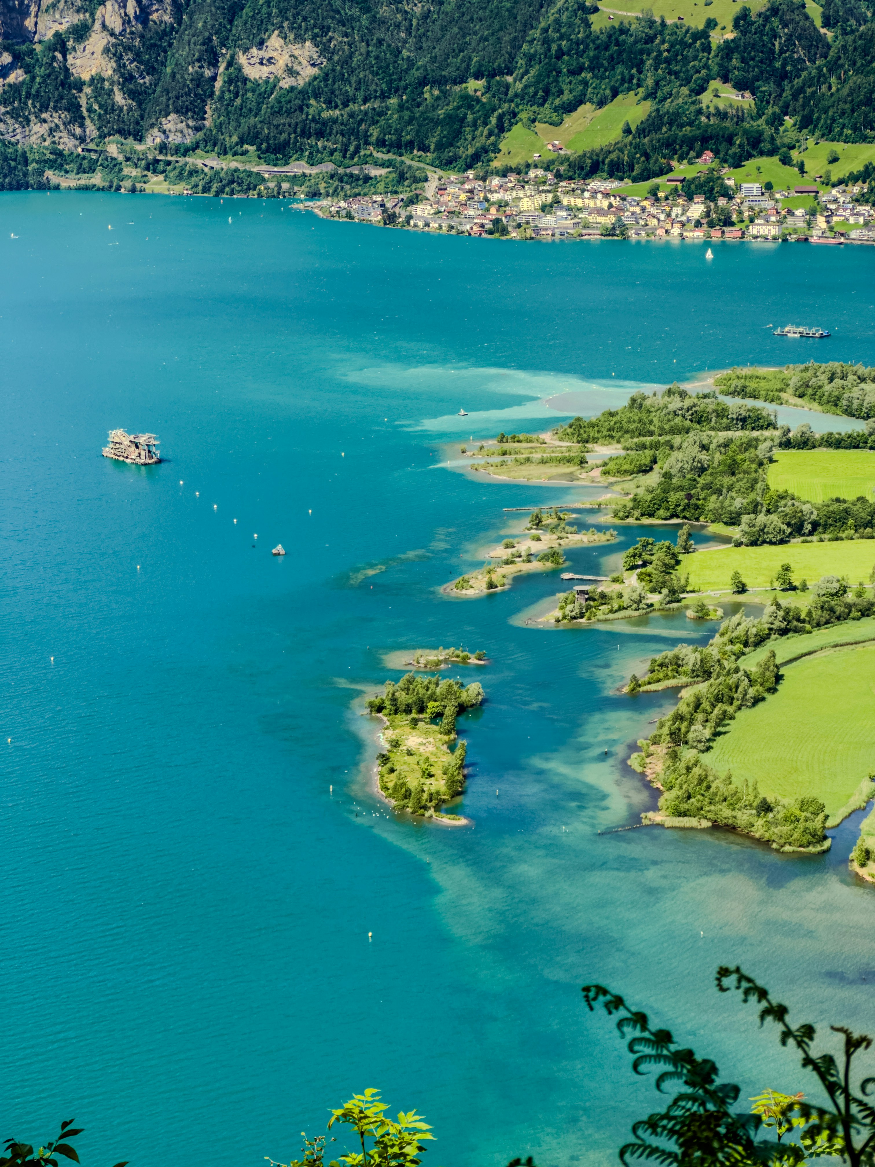 Azure Shoreline: Verdant Promontories Framing a Turquoise Lake