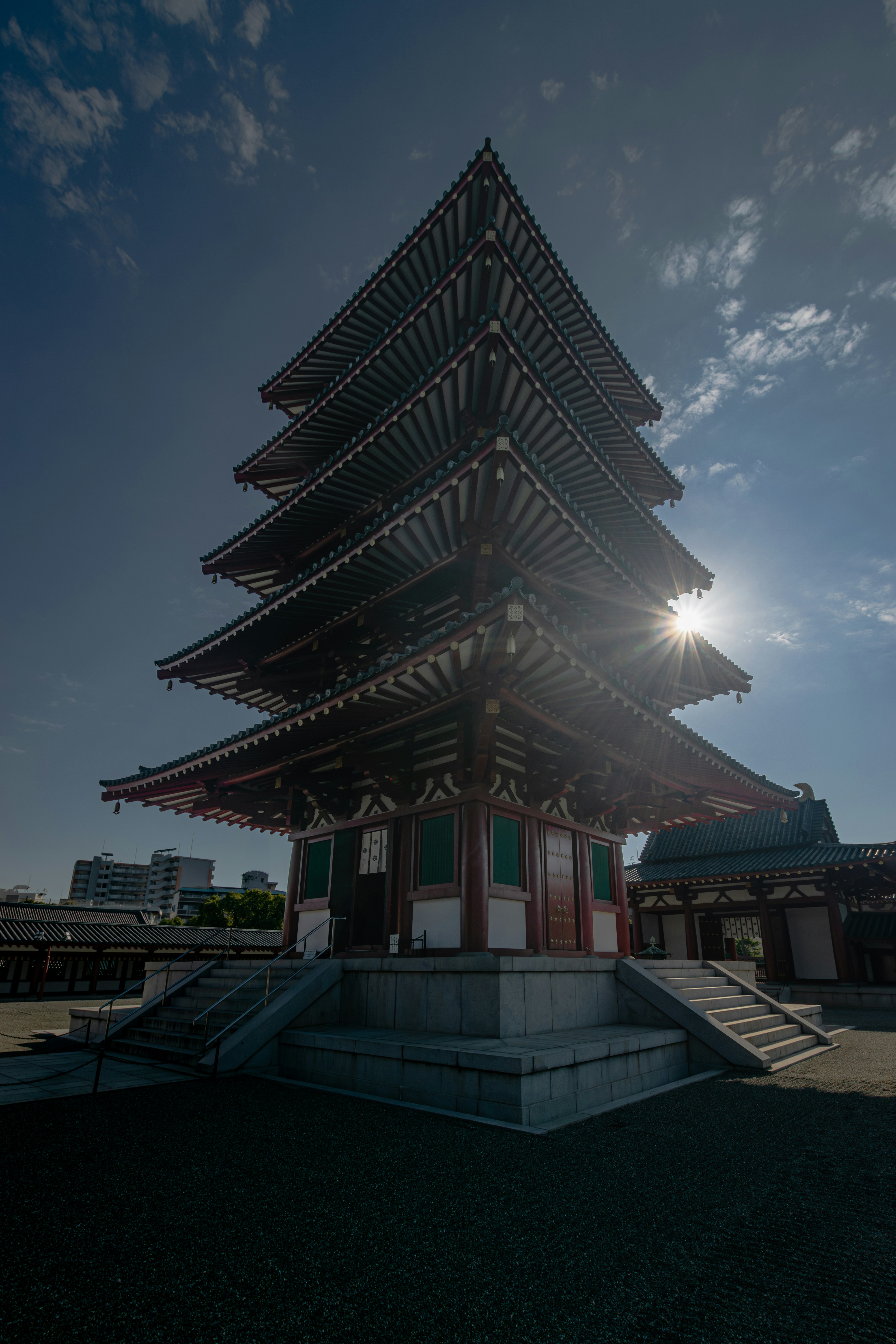 Sun flare at Shitenno-ji Temple on a blue sky morning. Osaka, Japan, Dec/23.