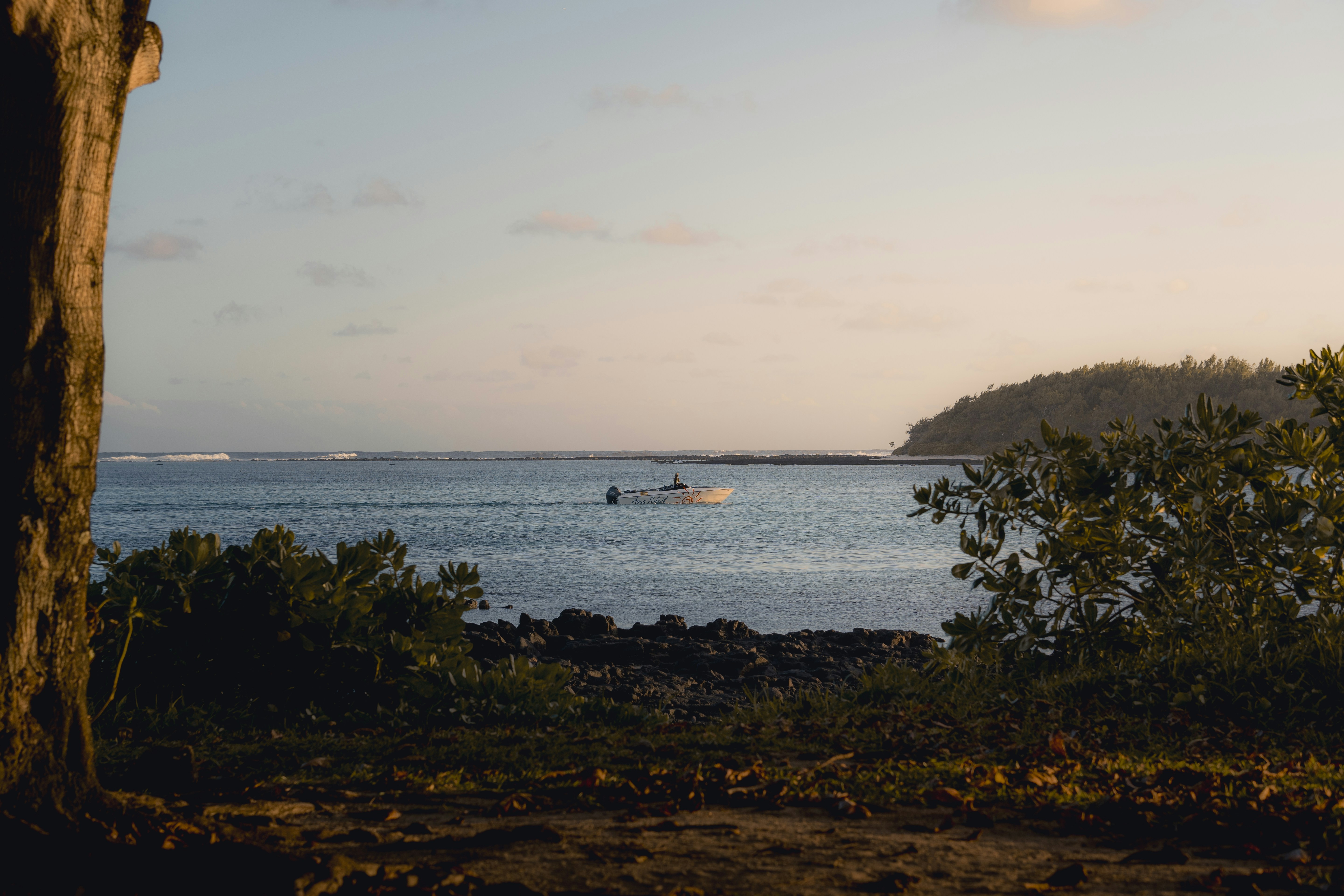 Dusk on the Quiet Gulf: A Lone Boat on the Horizon