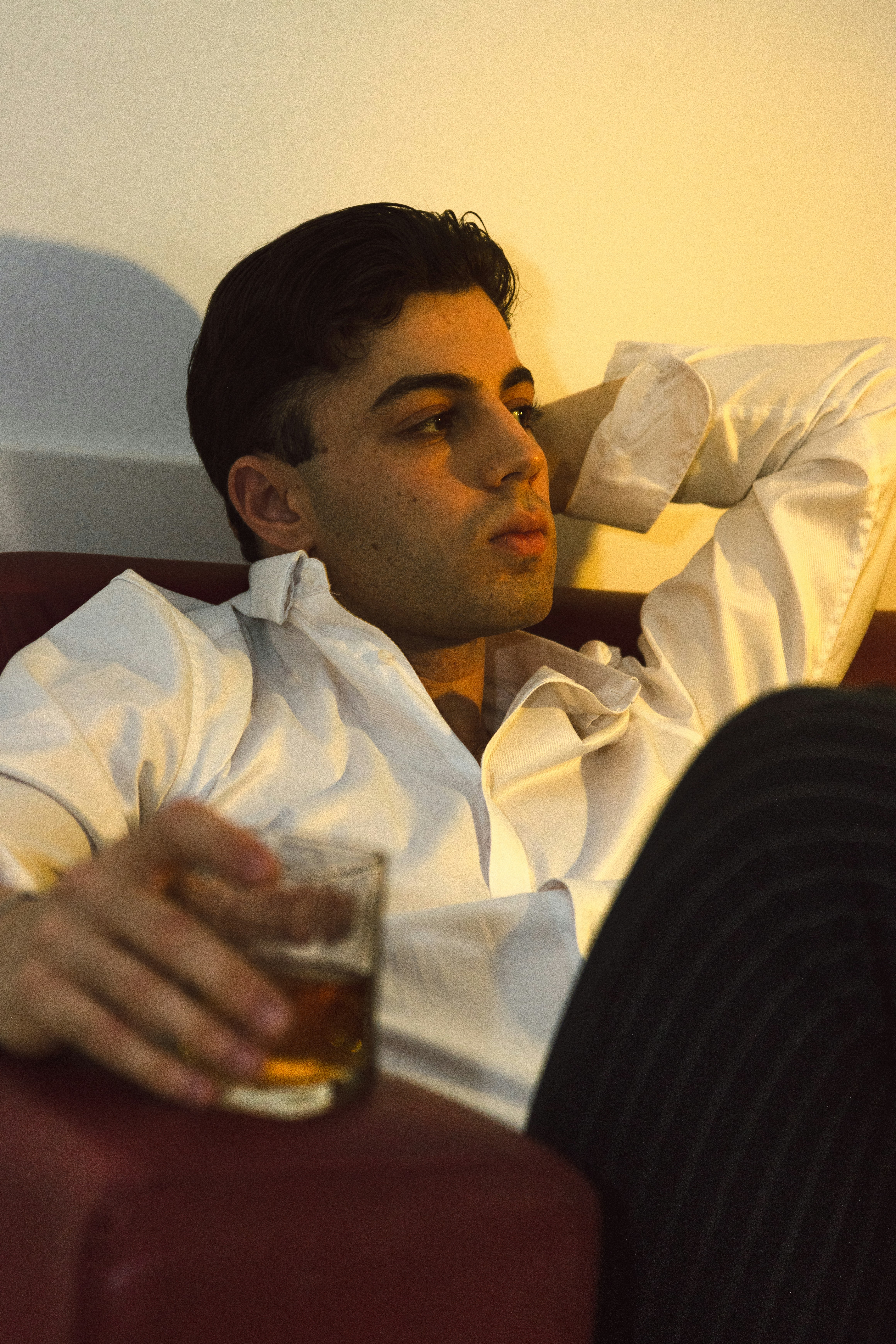 Quiet Confidence: A Lounge Portrait in Warm Amber