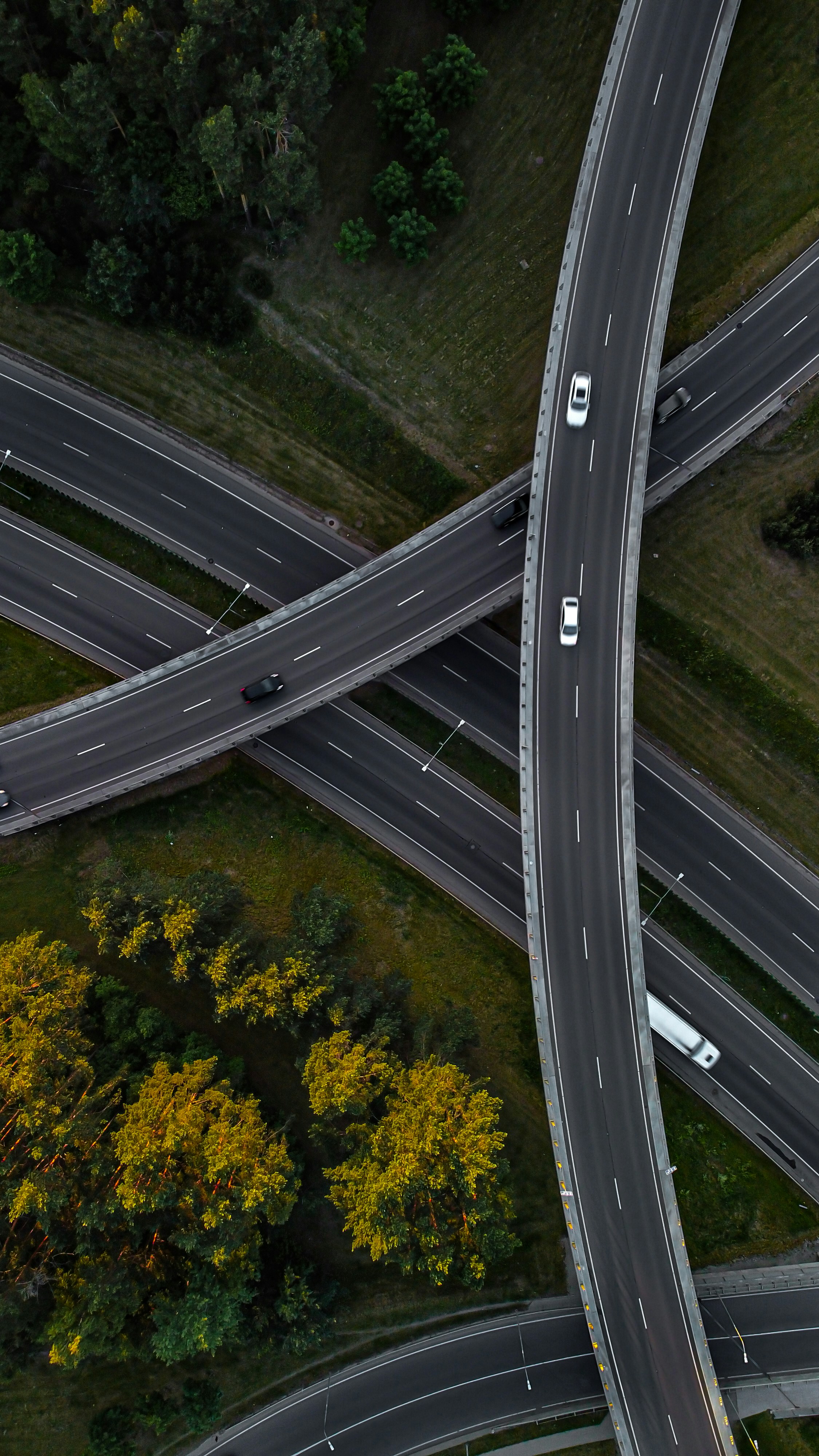 An aerial view of a highway intersection with multiple lanes photo ...