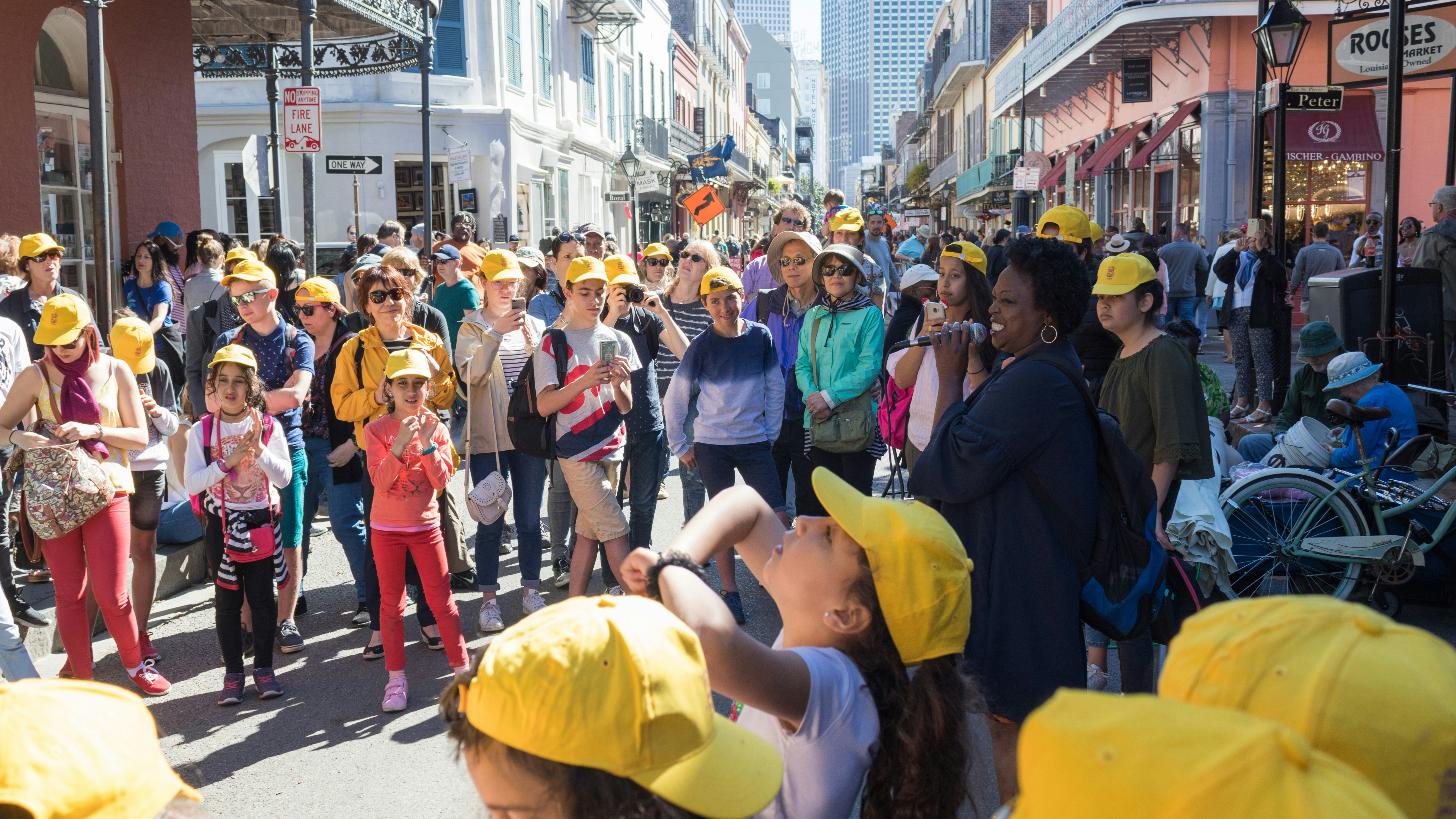 Yellow Hats in a Crowded Street Parade