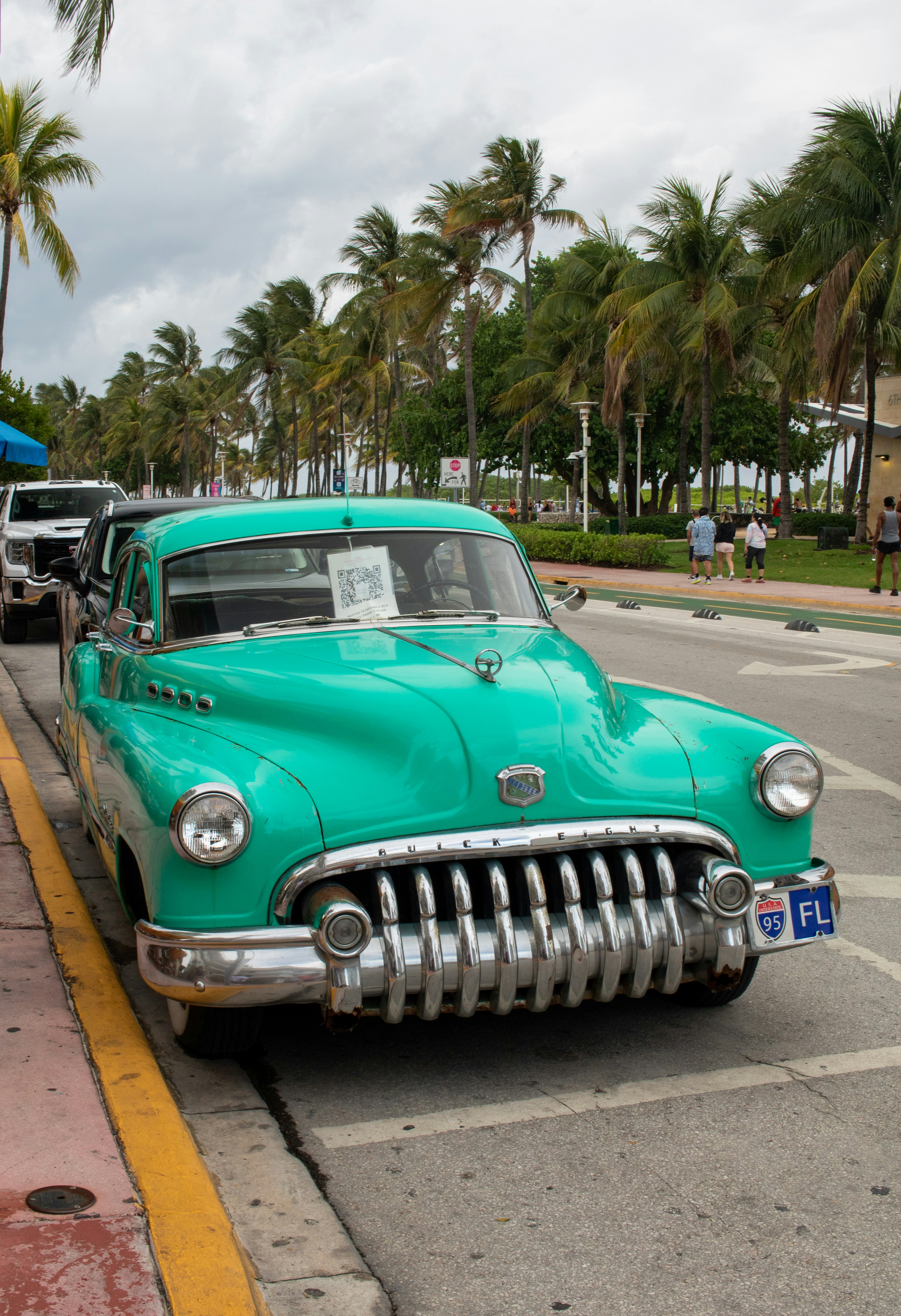 Teal Time Machine by the Palm-Lined Boulevard