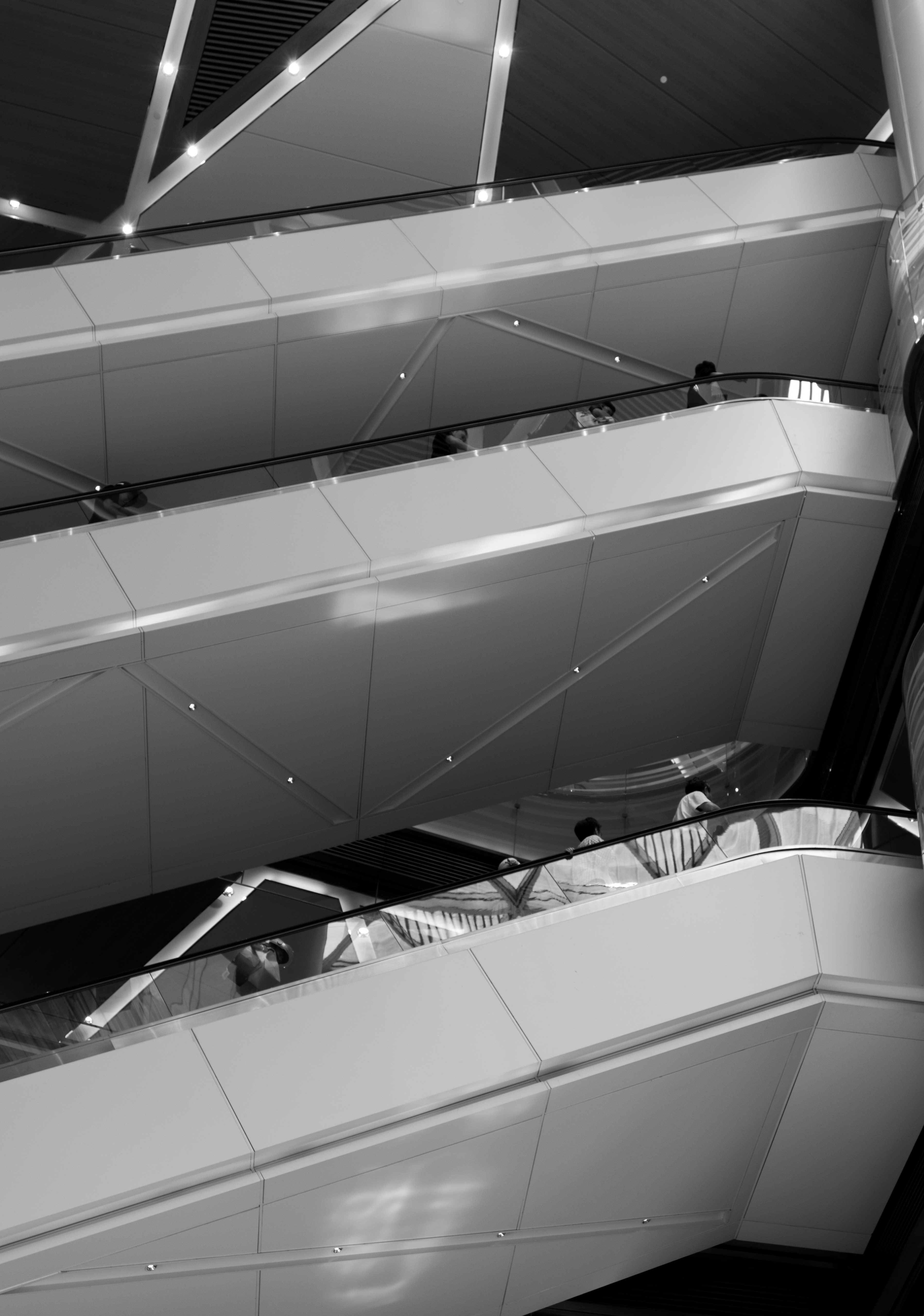 Geometric Ascension: Escalators Carve a Metallic Spiral