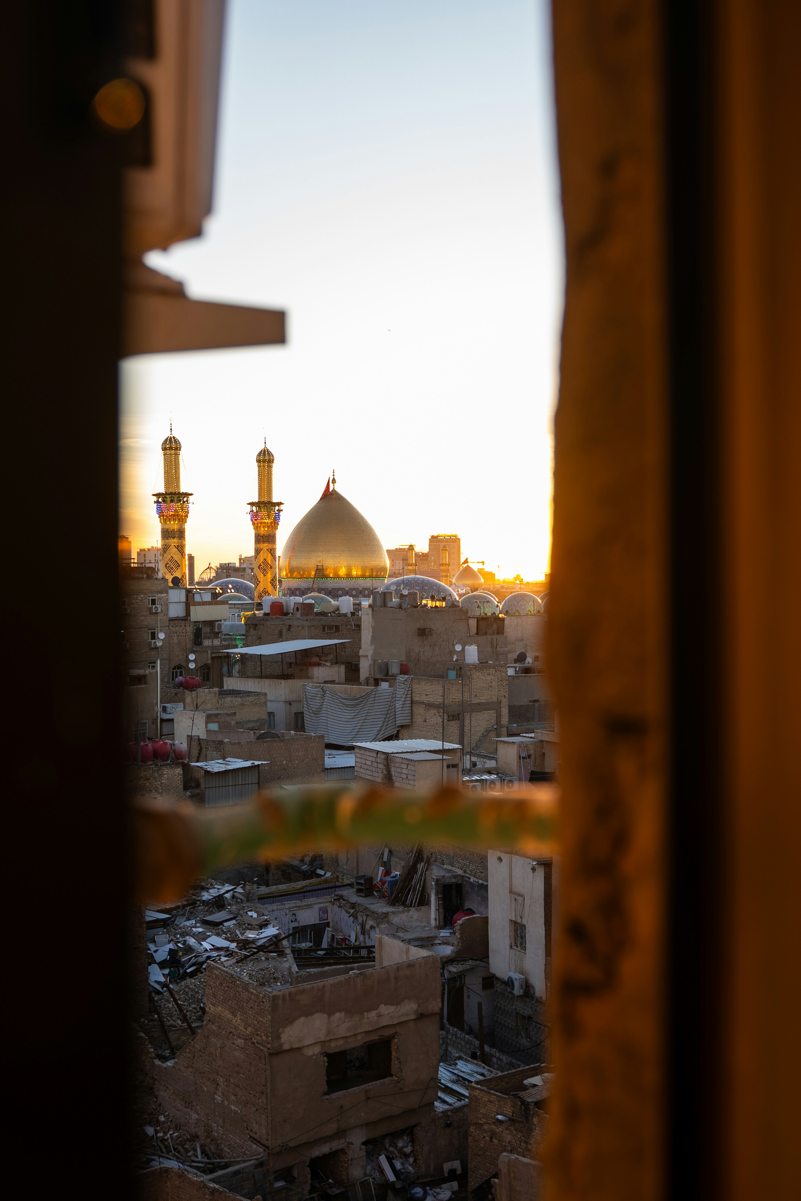 A view of a city from a window photo – Free Iraq Image on Unsplash