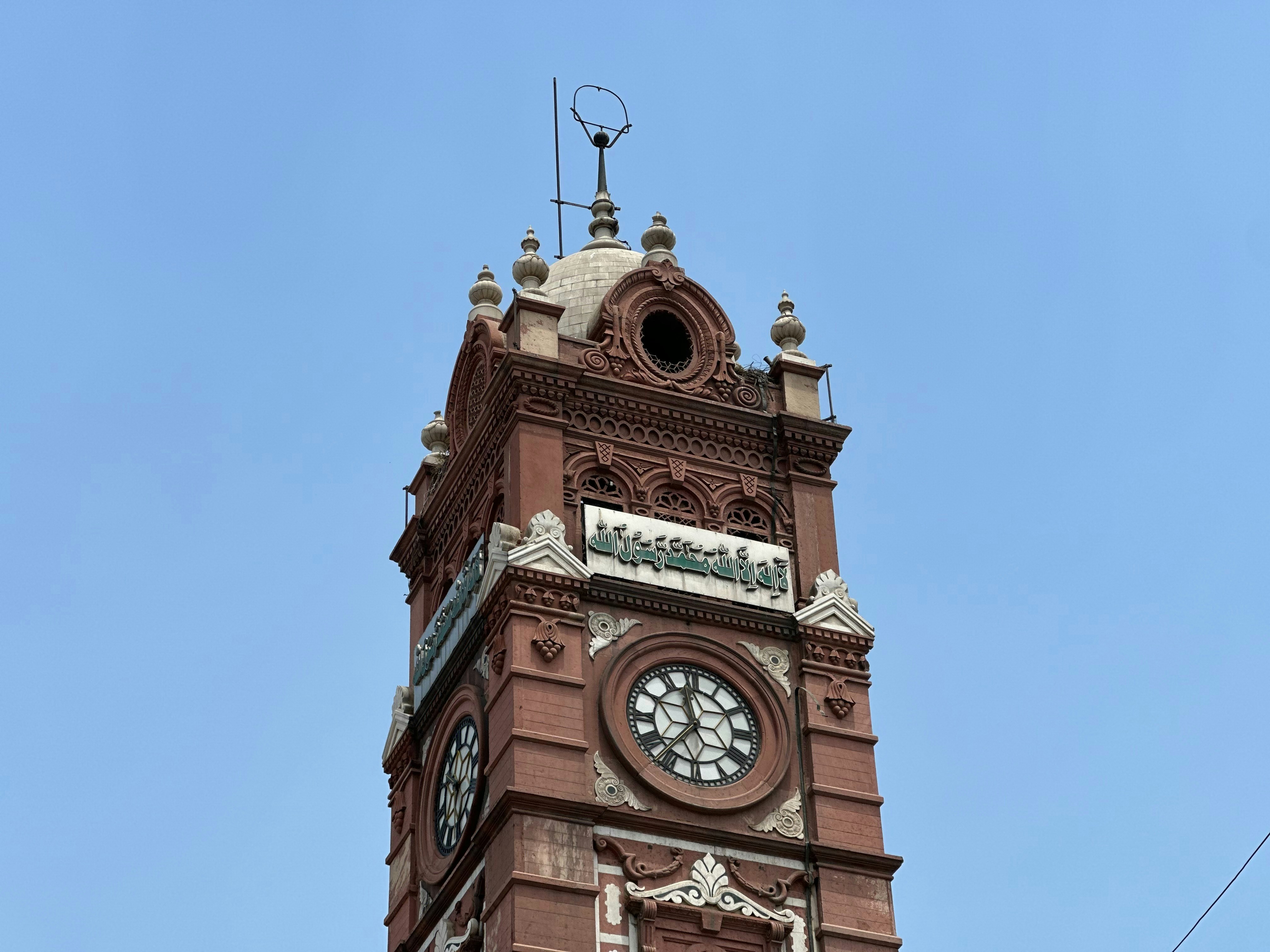 A tall clock tower with a clock on each of it's sides photo – Free ...