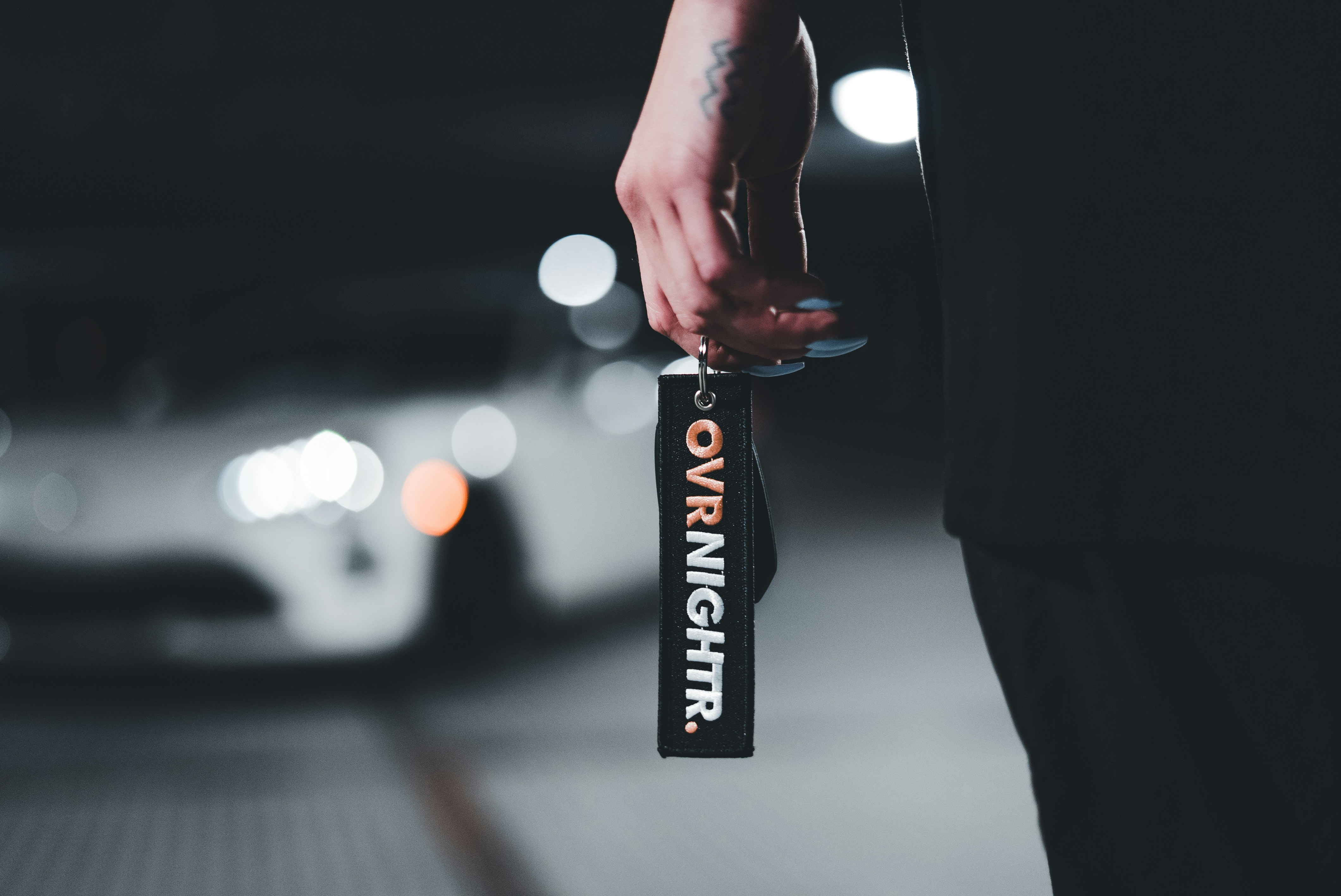 Overnight Lanyard in a Quiet Neon City After Dark