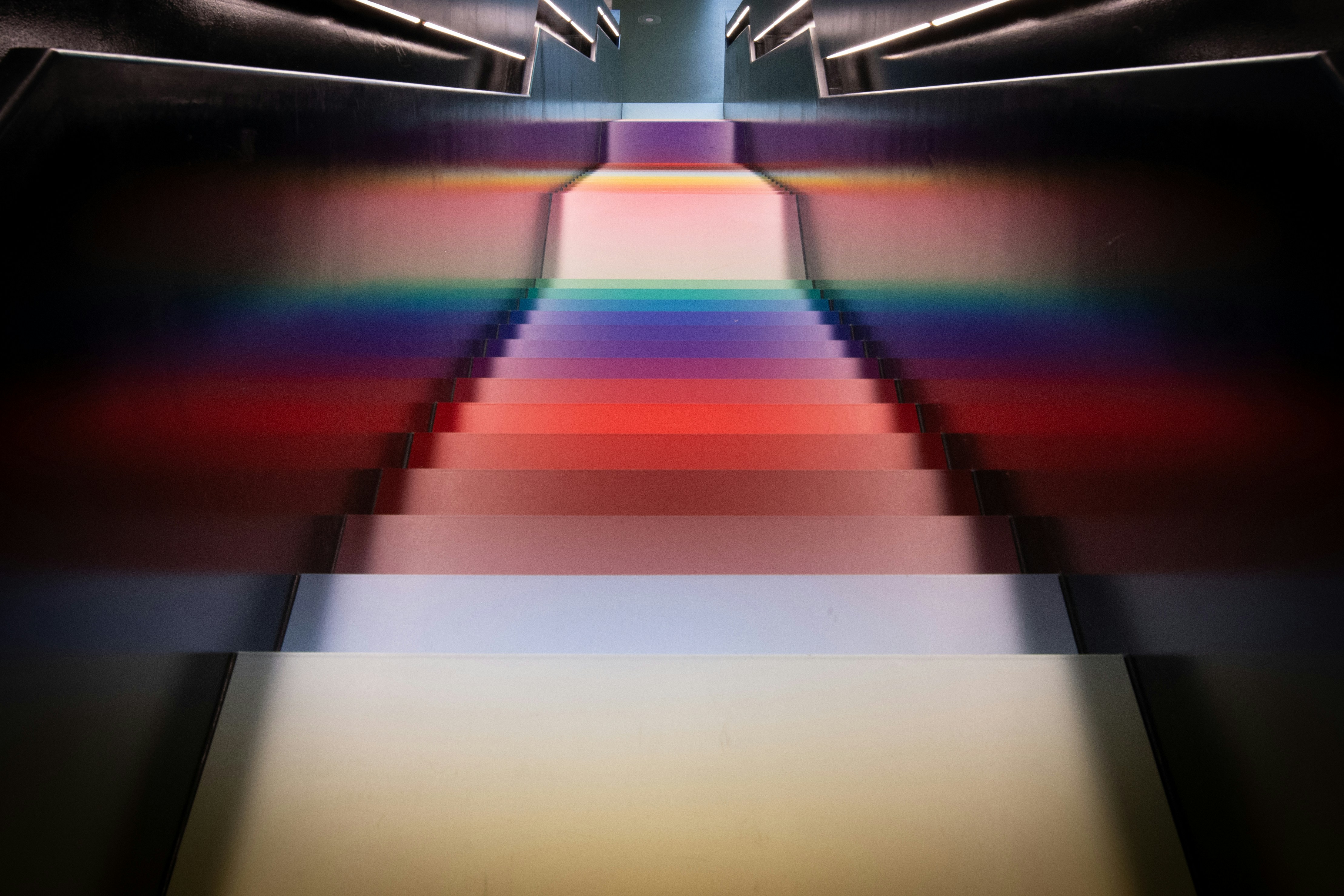 A long narrow hallway with a rainbow light at the end photo – Free Blox ...