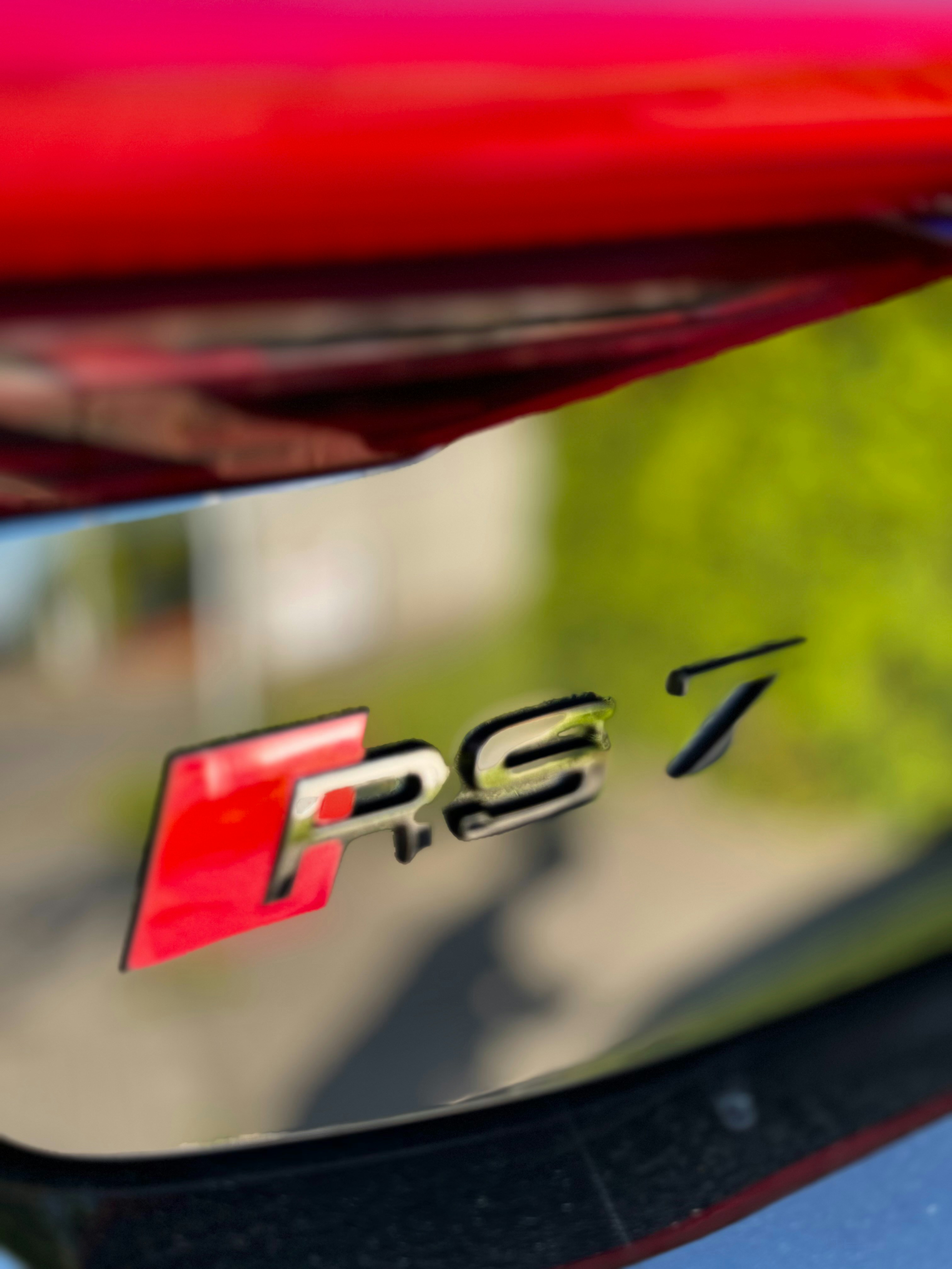 Crimson Reflections: The RS7 Badge in a Close-Up