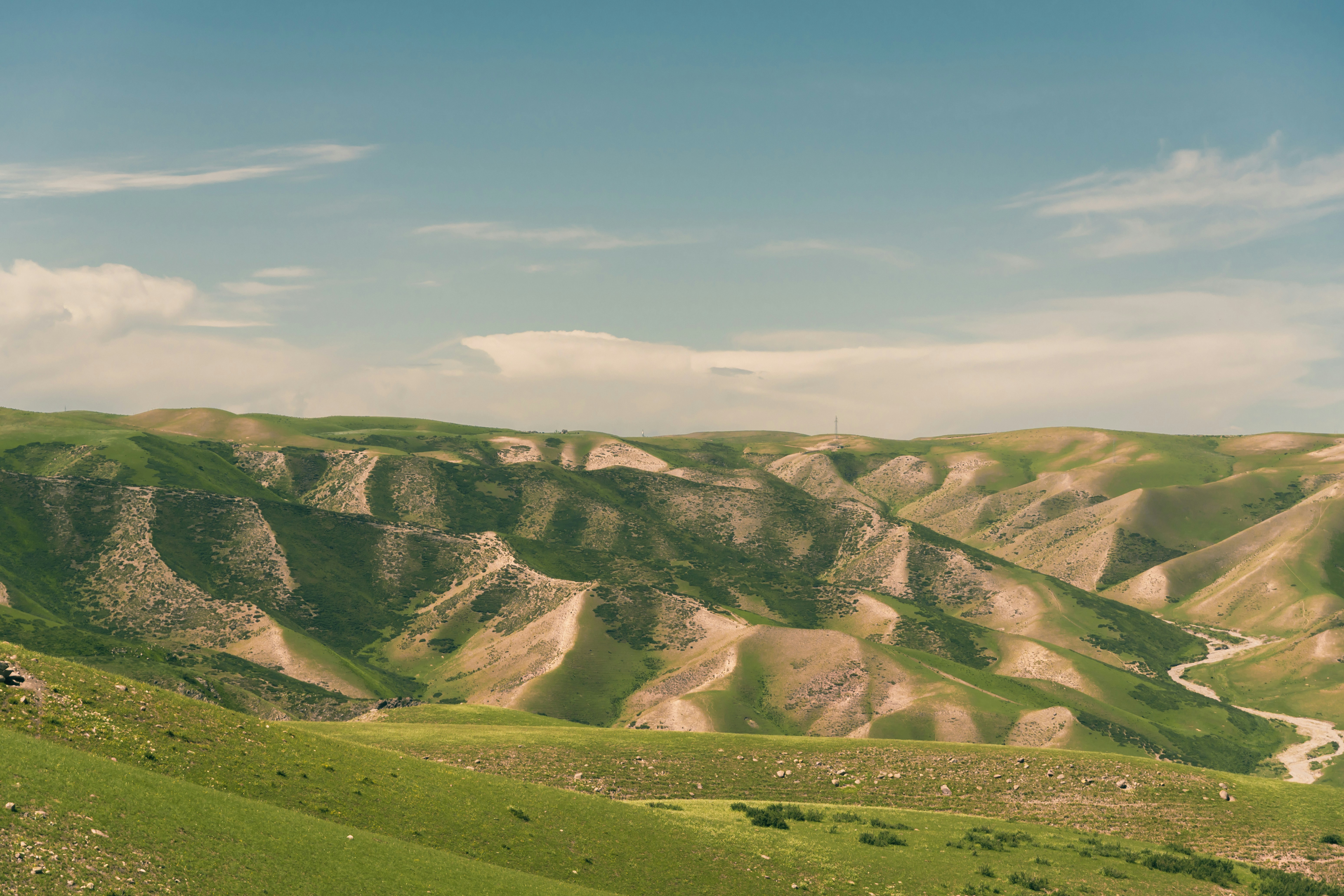 A scenic view of a valley with a river running through it photo – Free ...