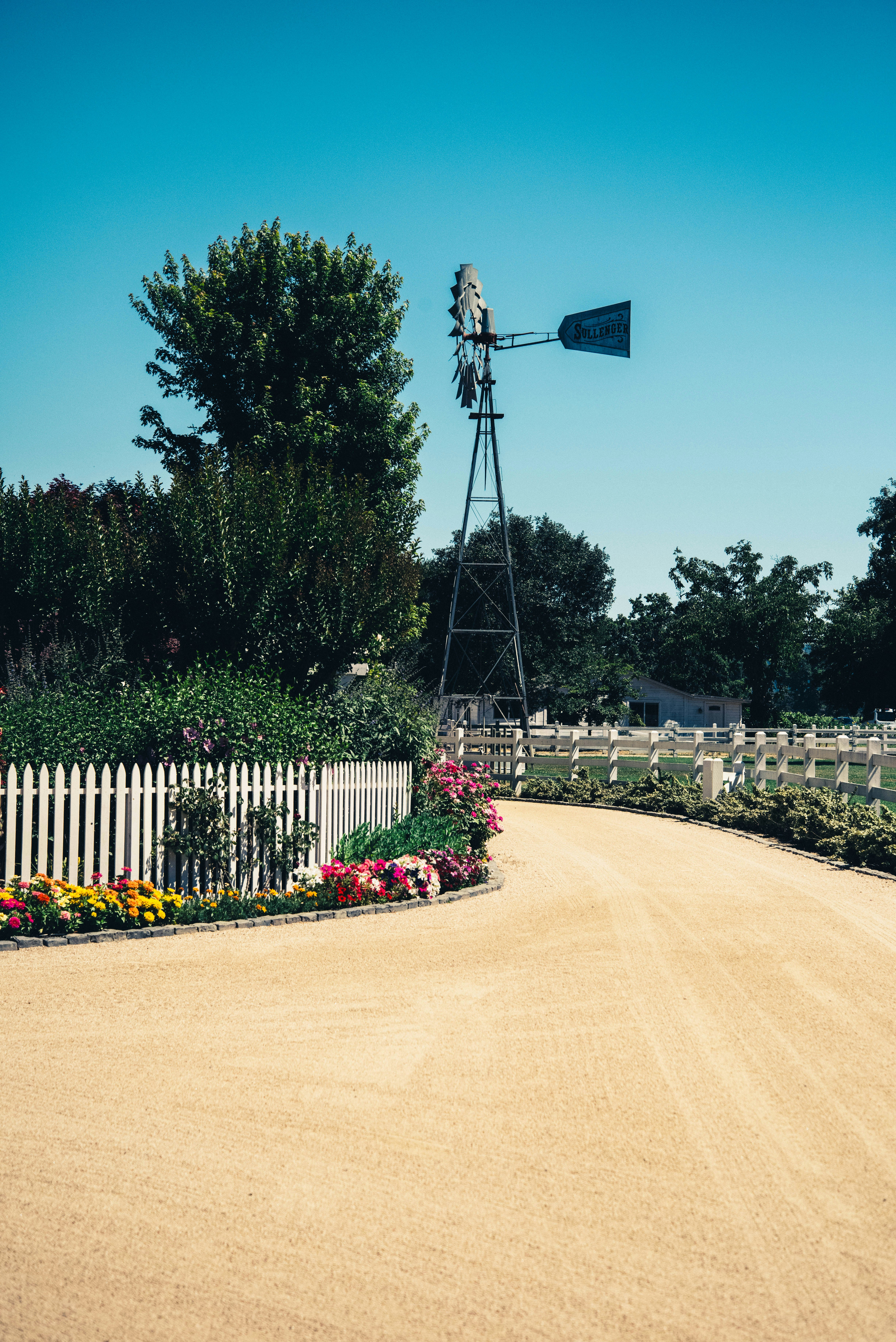Country Lane with Windmill and Garden Fence