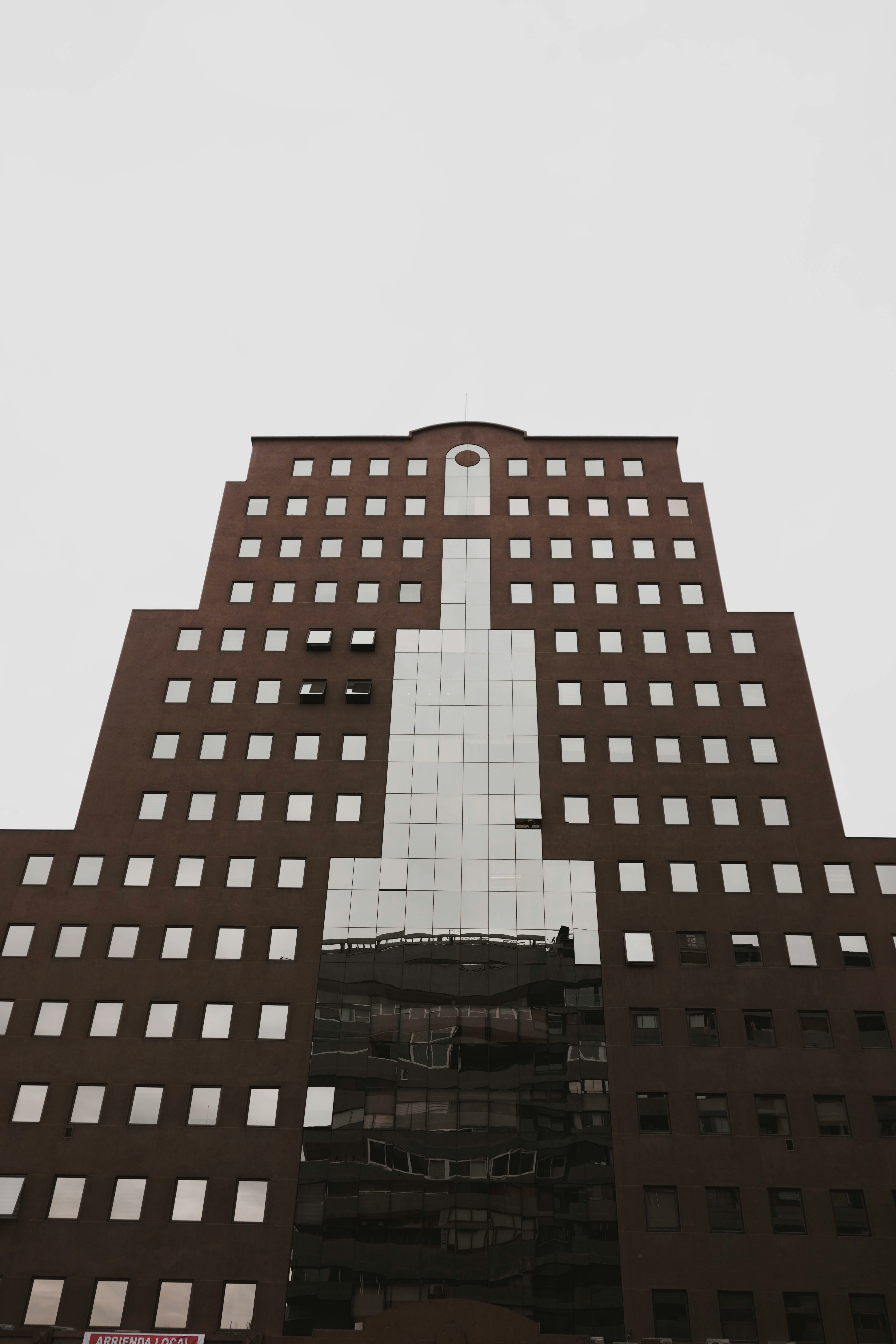 Urban Monument: The Central Atrium Tower Rising Through Brick Facades