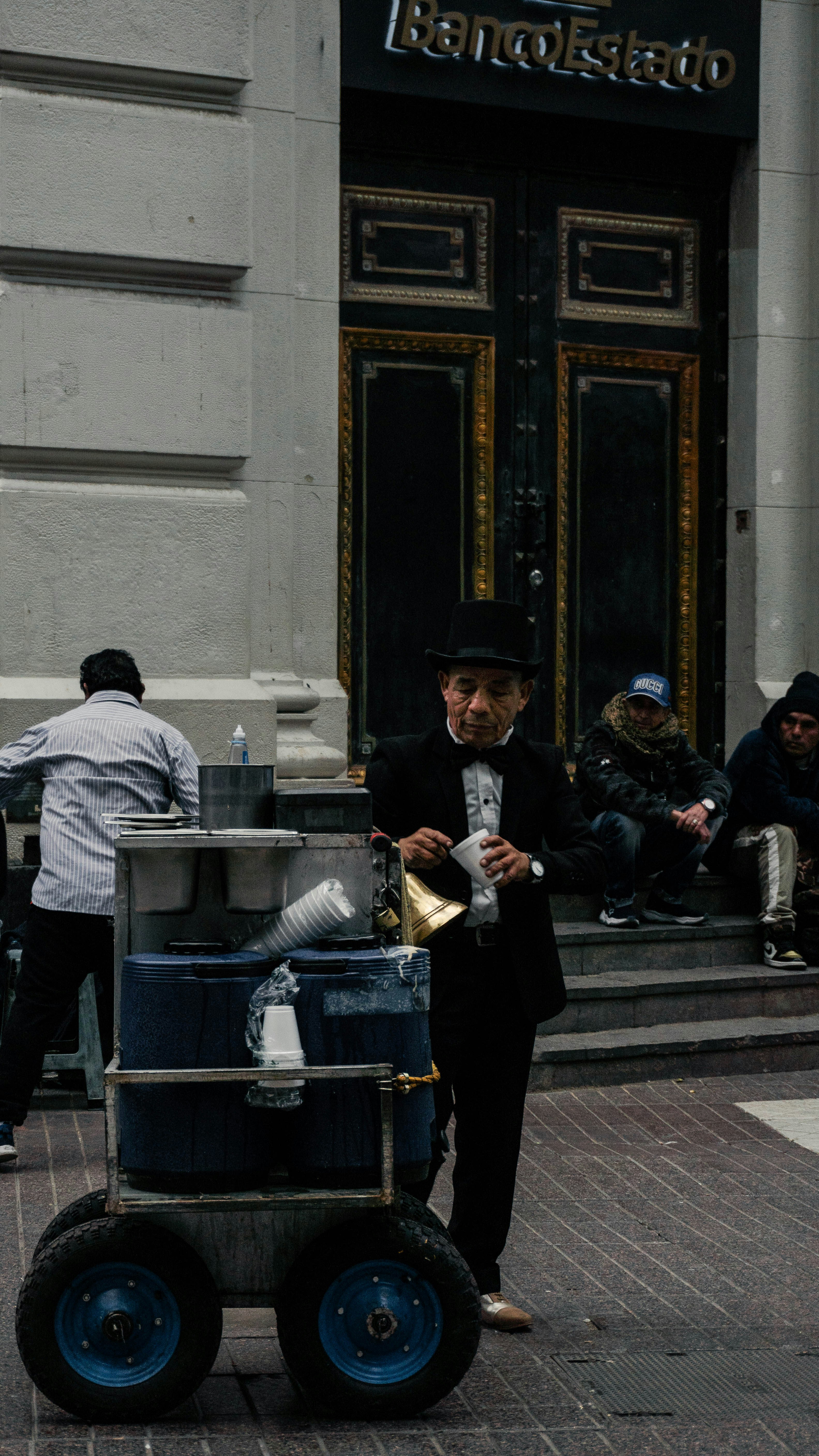 Velvet-Topped Vendor at the Bank's Threshold