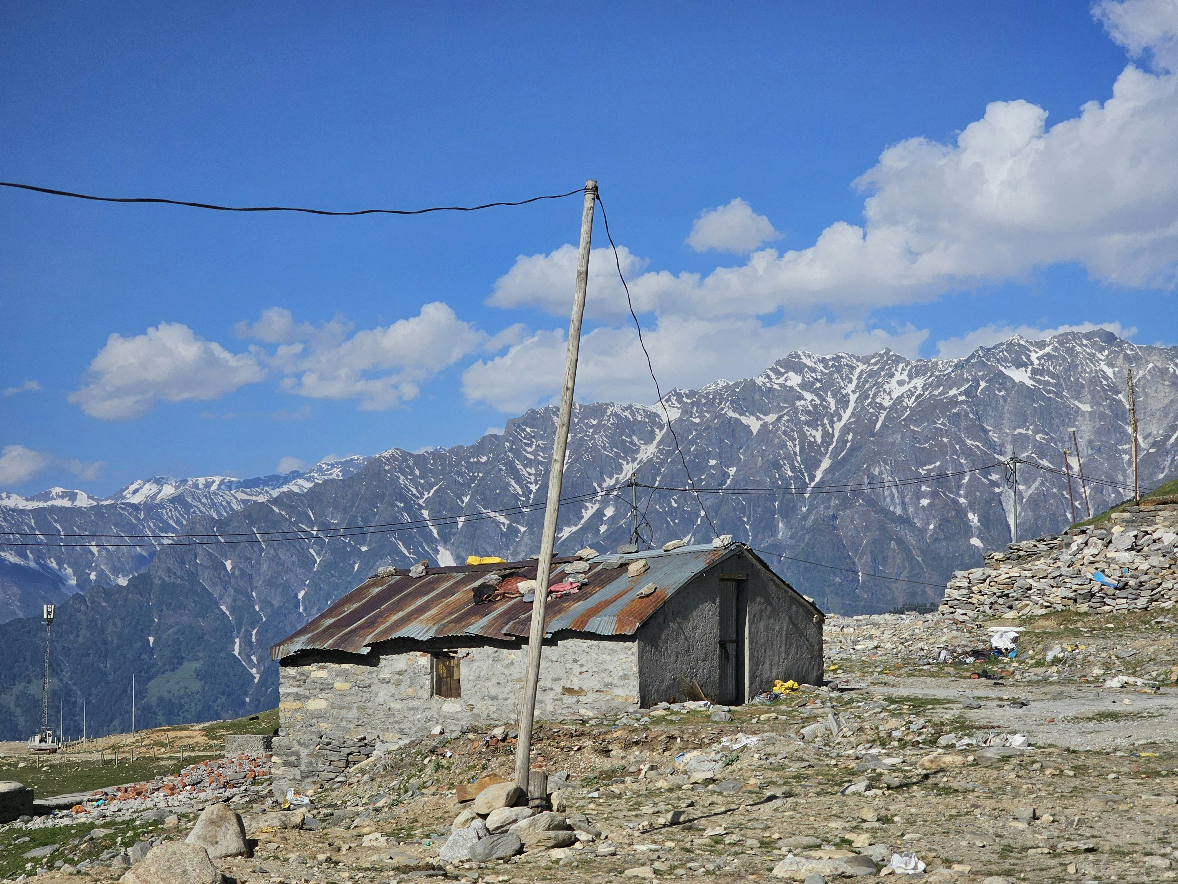 A small shack sitting on top of a mountain photo – Free Rohtang pass ...