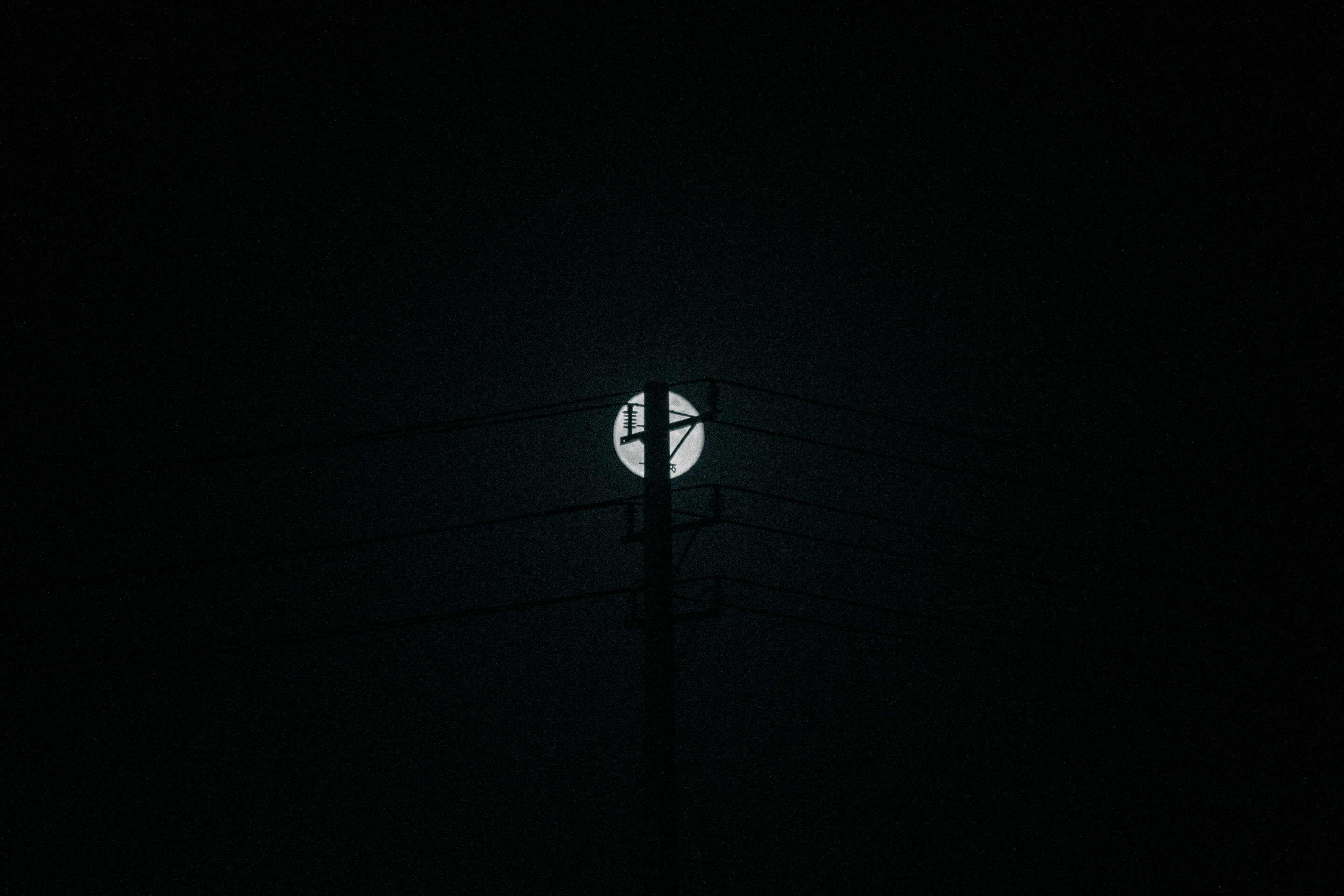 Moon Through the Wires: A Quiet Night Portrait