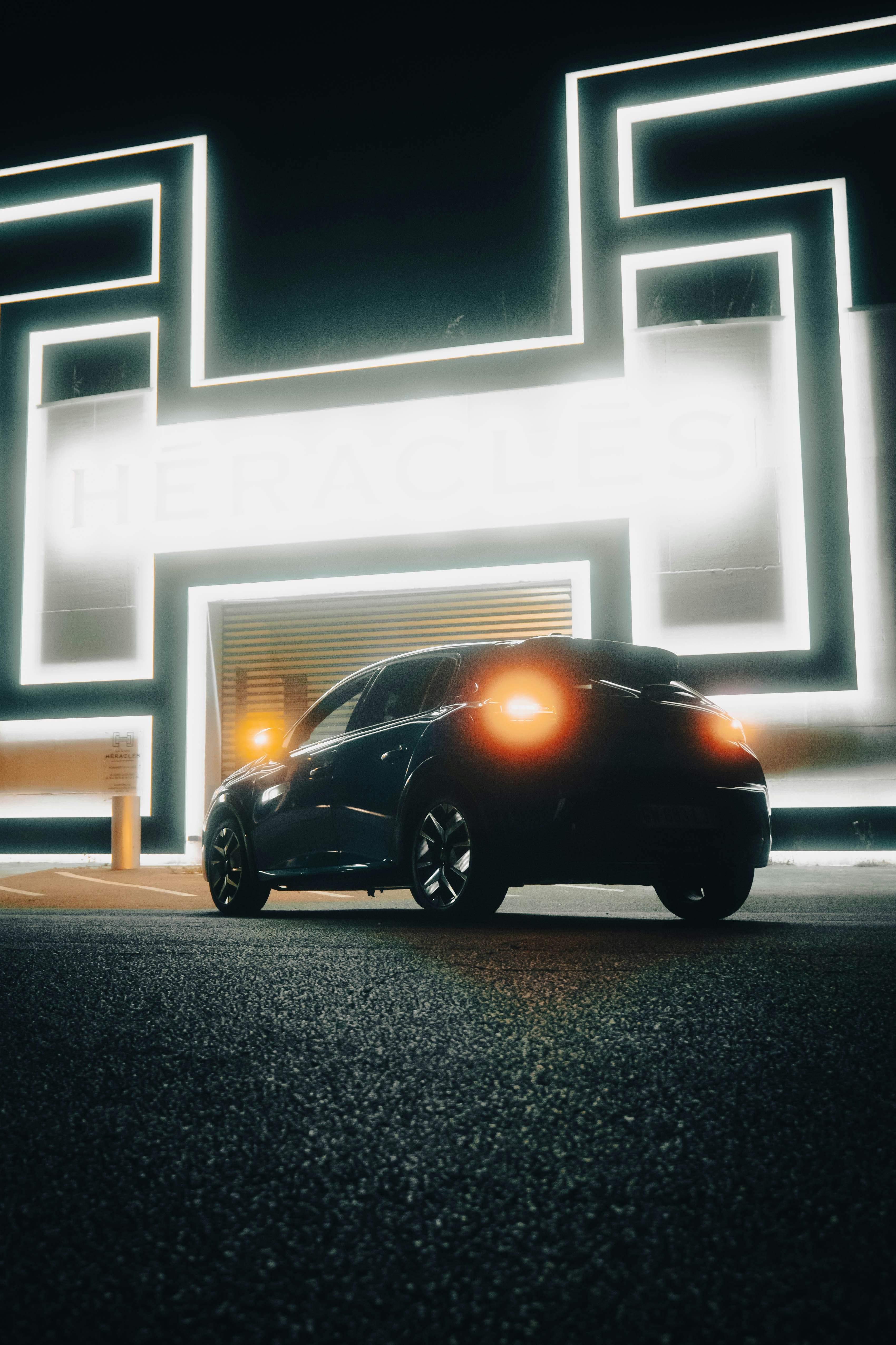 Midnight Coupé Under a Neon Geometric Glow