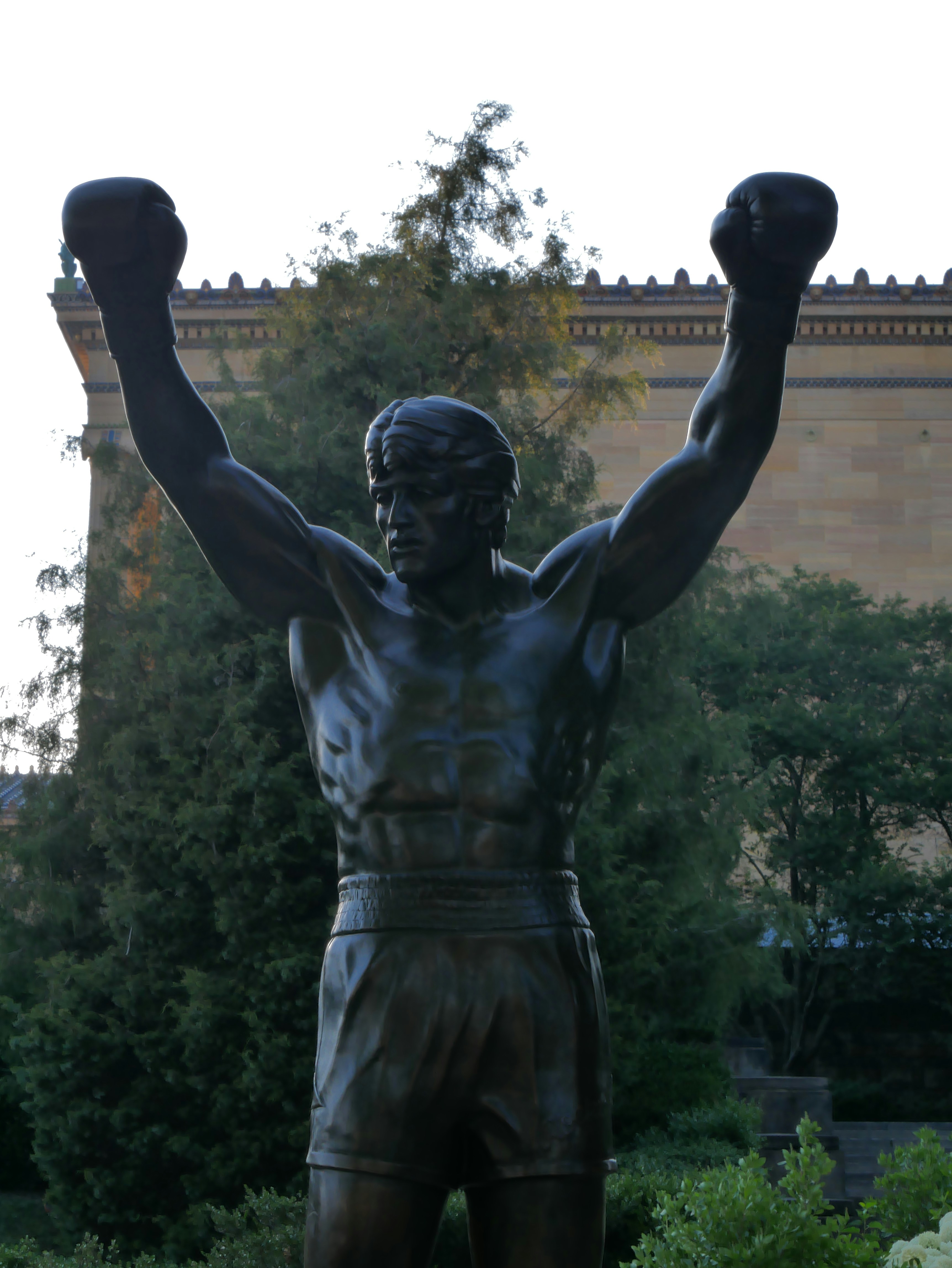 A statue of a man holding two boxing gloves photo – Free Art Image on ...