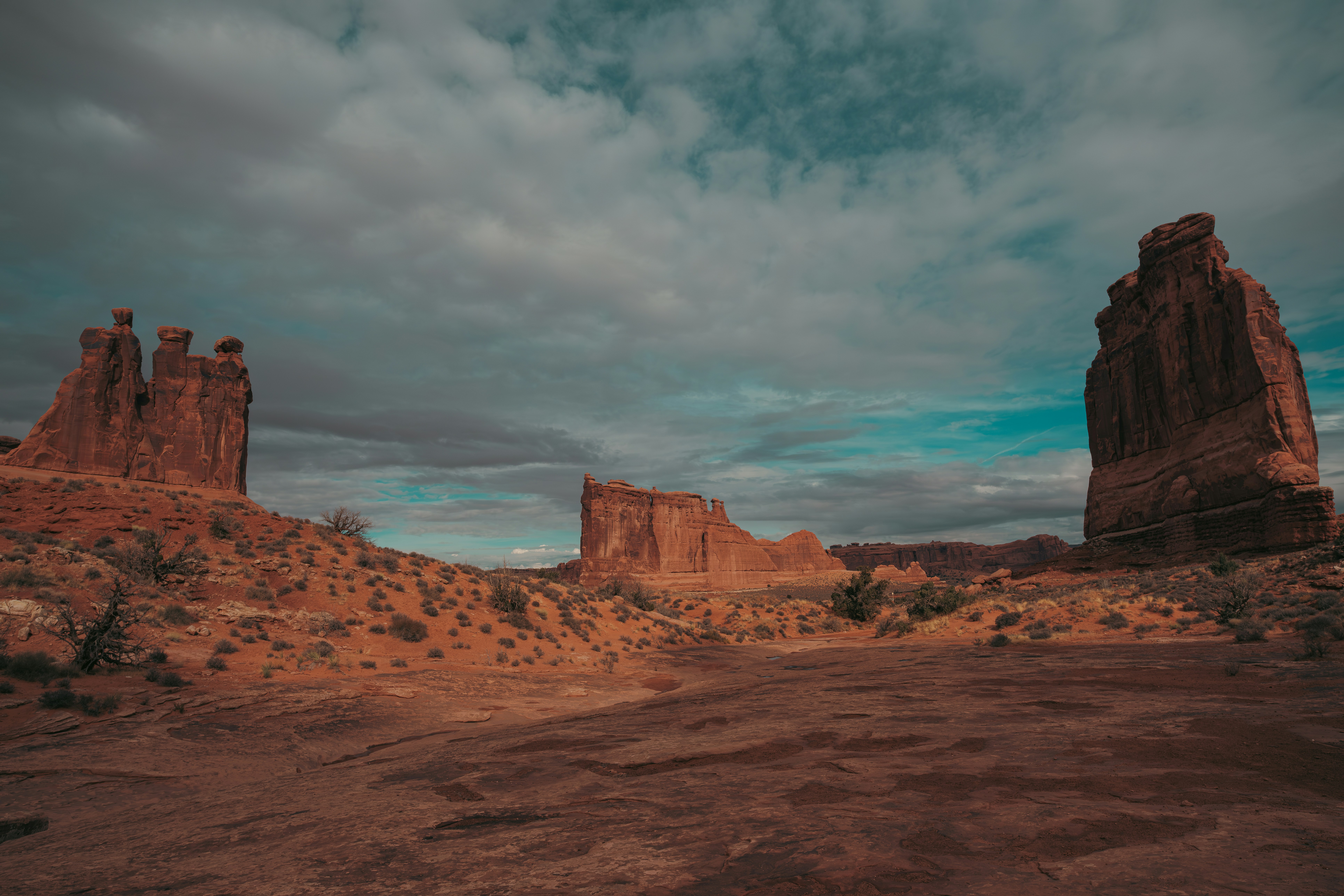 A desert landscape with rocks and a cloudy sky photo – Free Usa Image ...