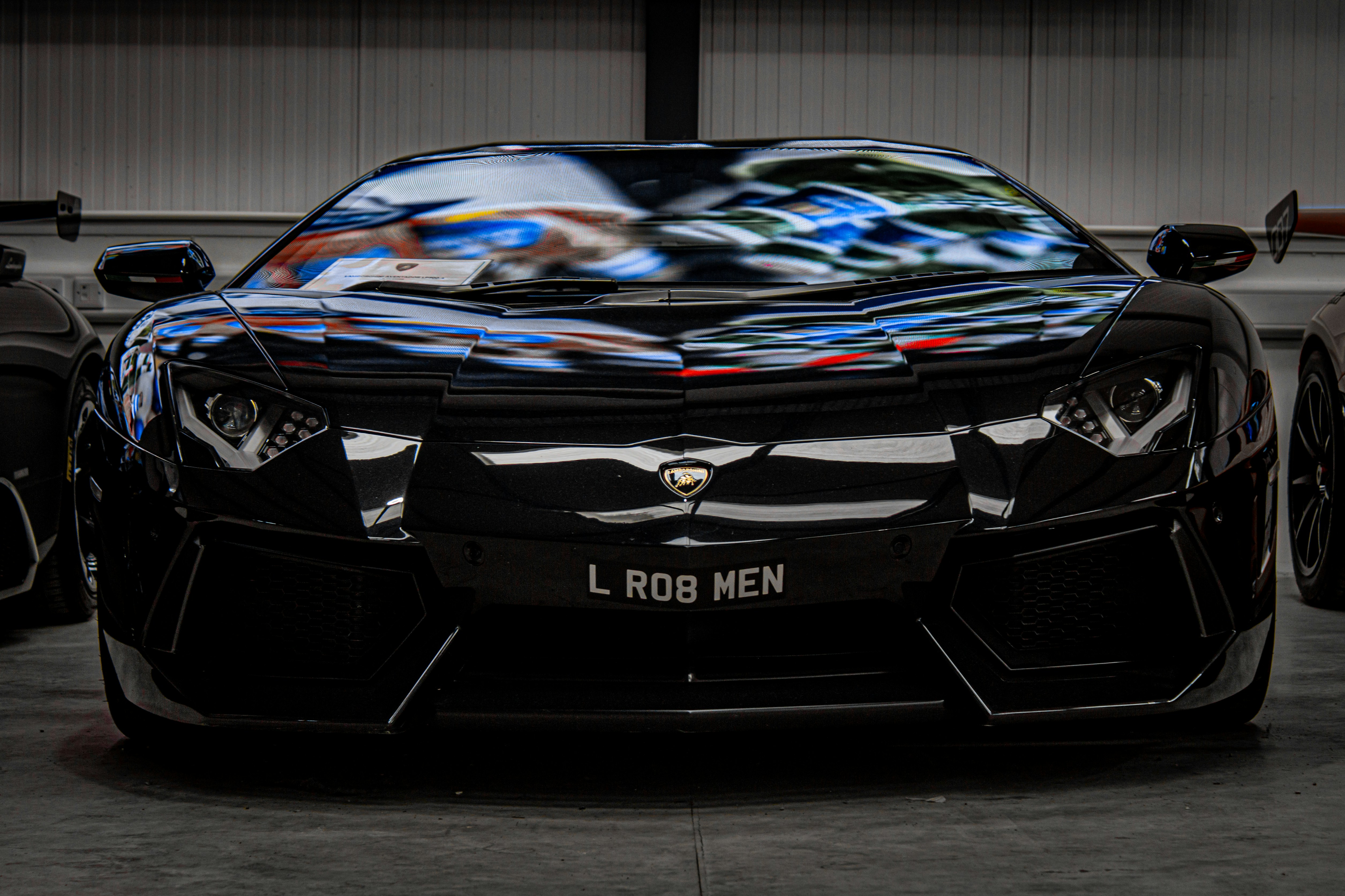 Midnight Contour: A Sleek Hypercar Under Fluorescent Vigil