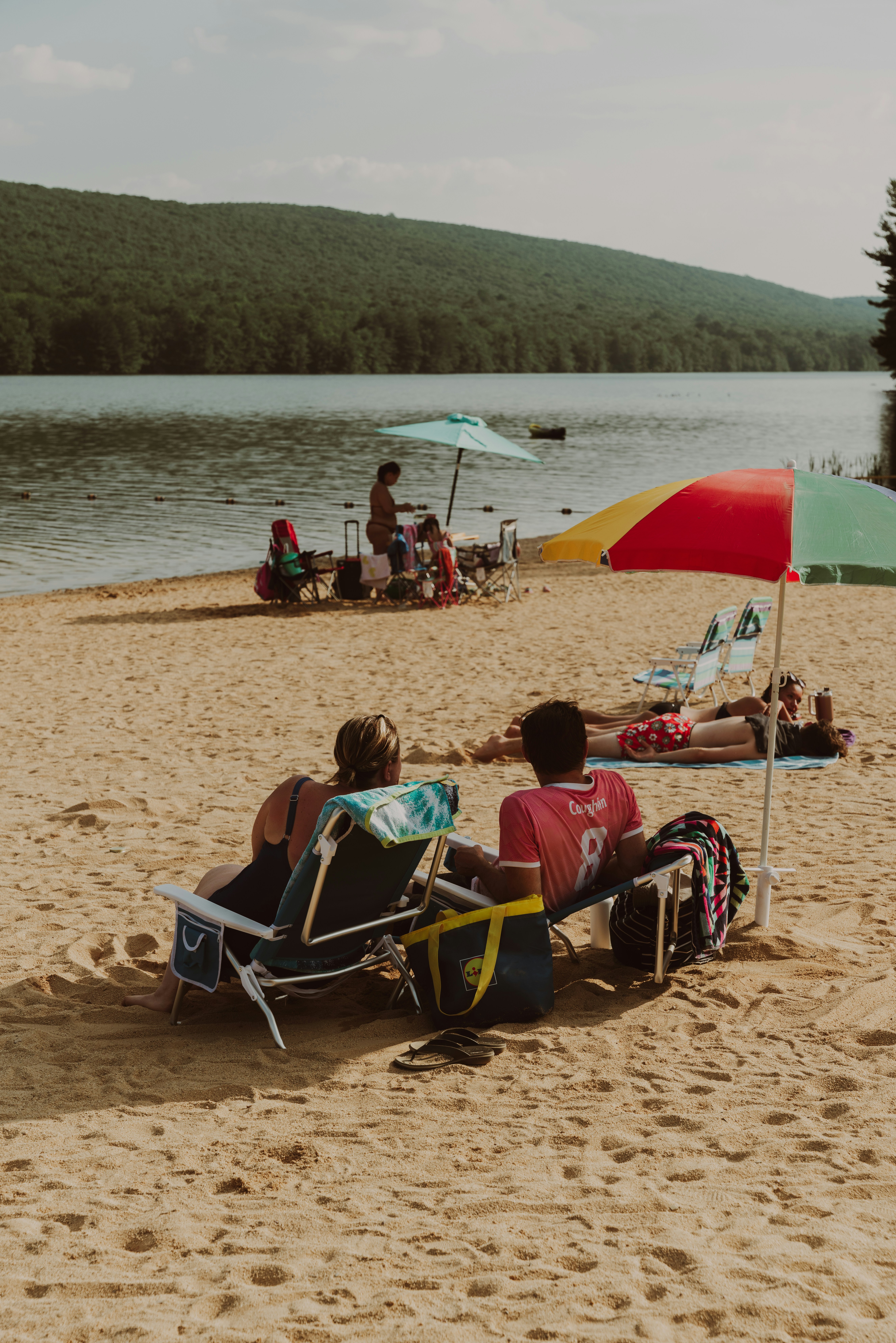 Lakeside Siesta Under a Rainbow Umbrella