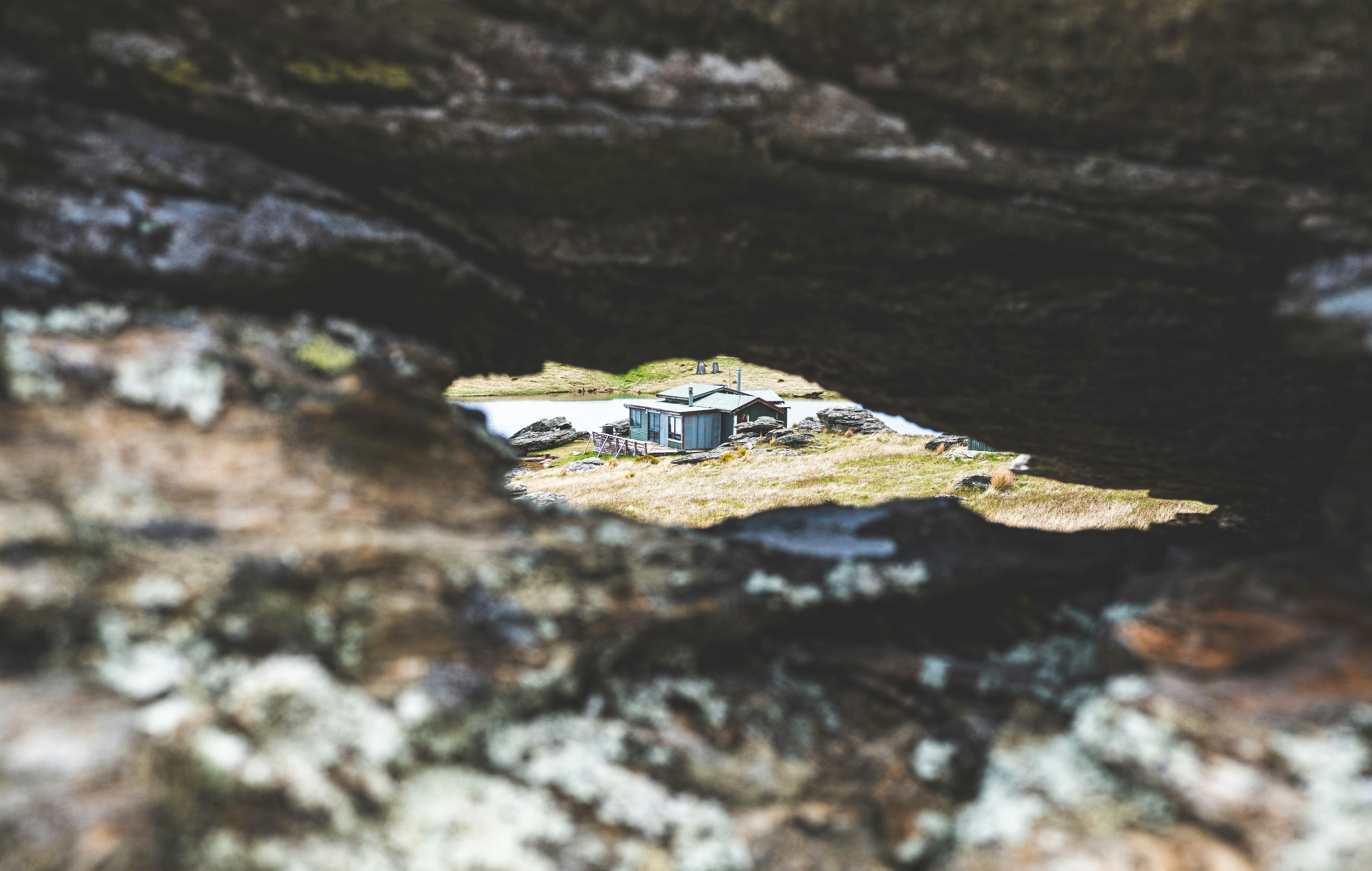 Hidden Studio: A Tiny Building Framed by Petroglyphic Rock