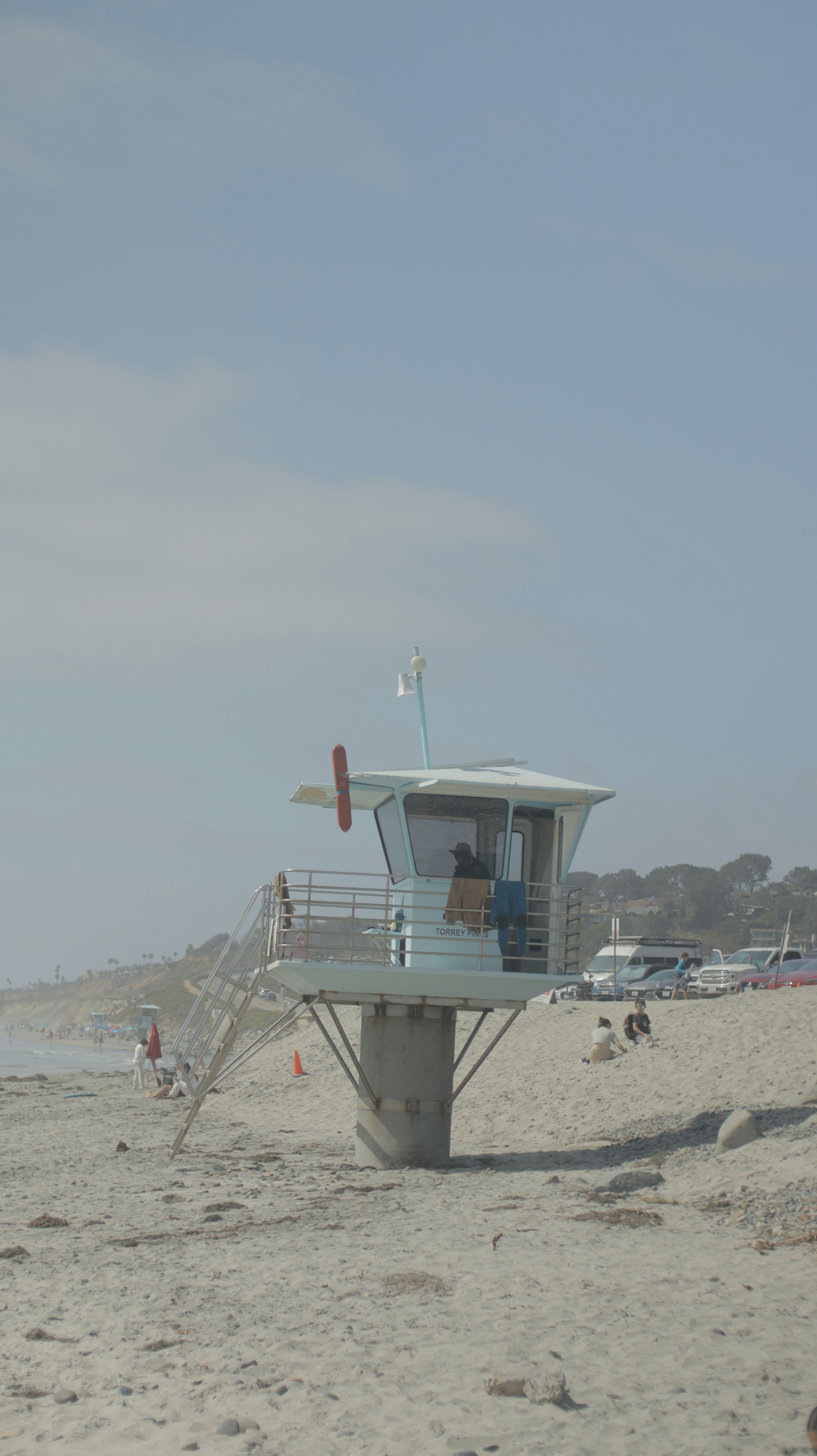 Sentinel on the Sand: Lifeguard Tower Over a Quiet Beach