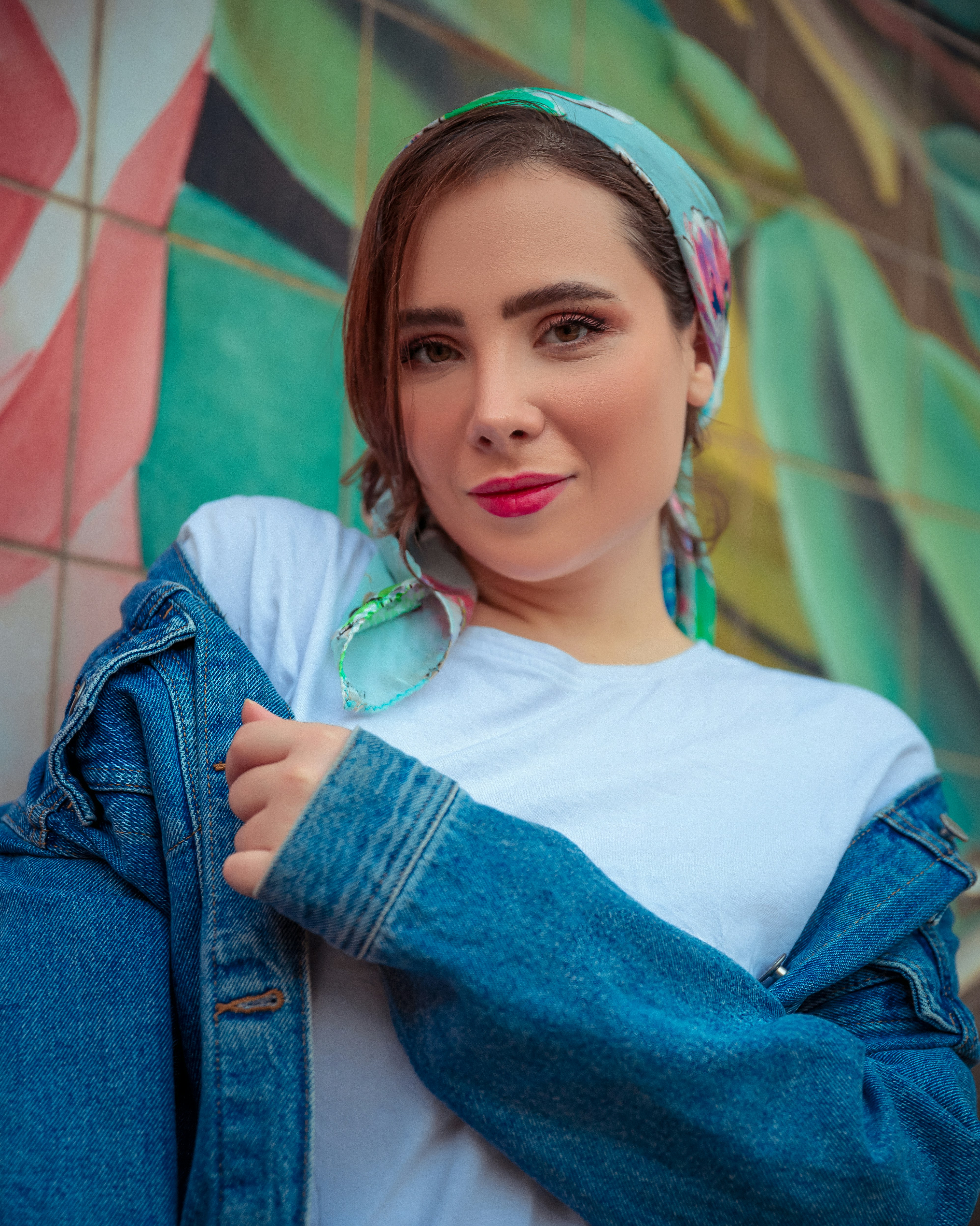 Color-washed Confidence: Portrait Against a Kaleidoscopic Wall