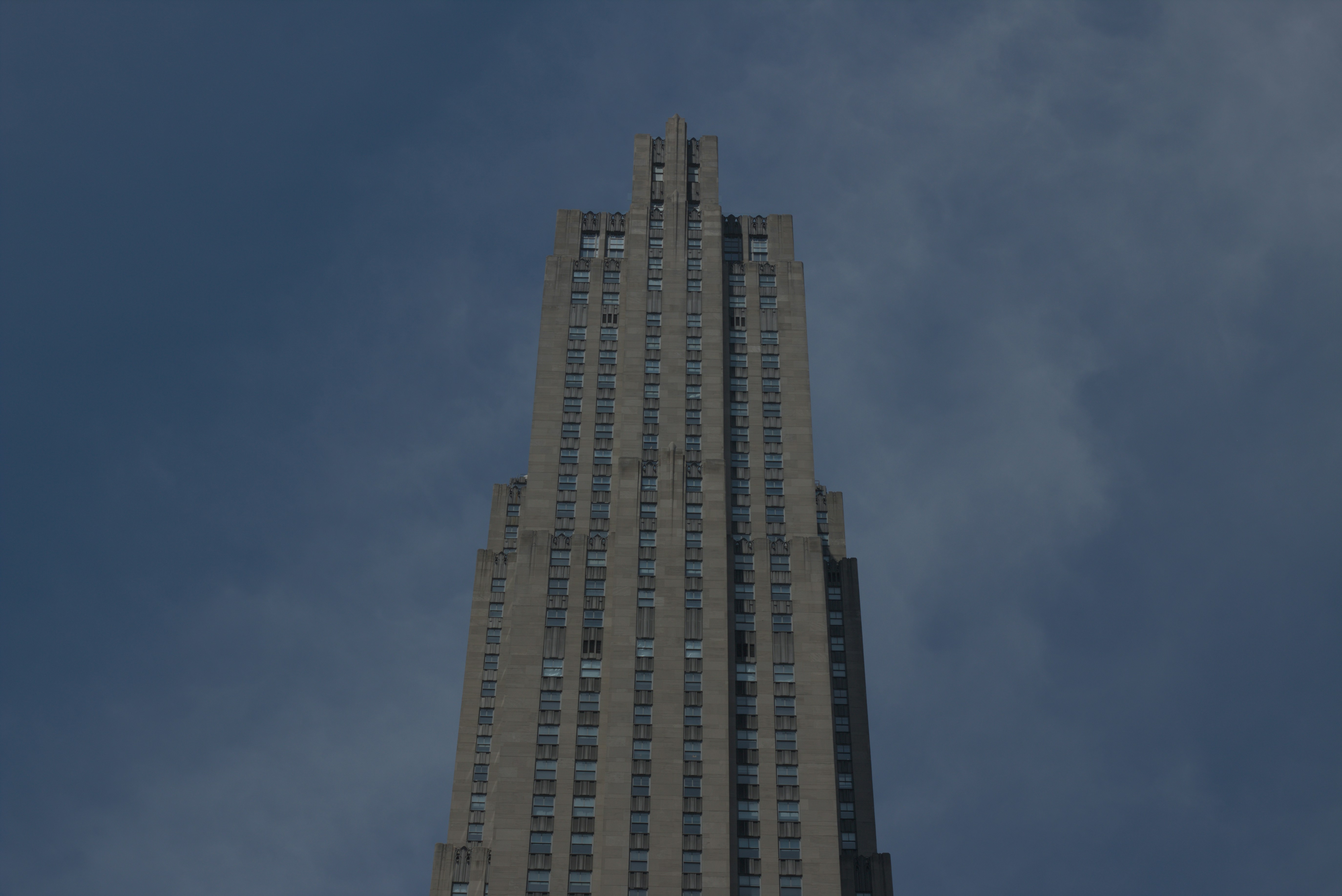 Apex of Steel: The Narrow Tower Piercing a Quiet Sky