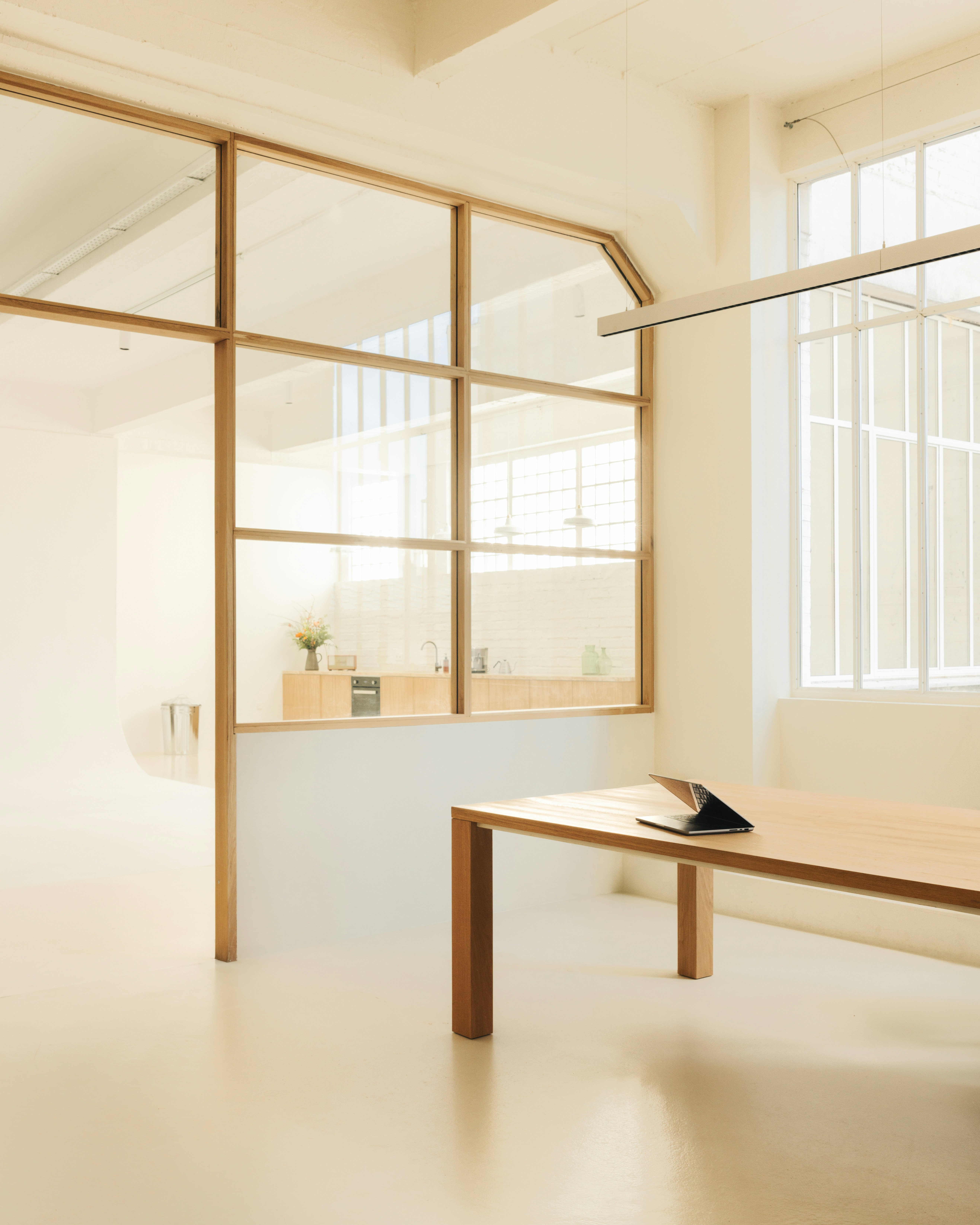 An empty room with a wooden table in it photo – Free Fashion Image on ...