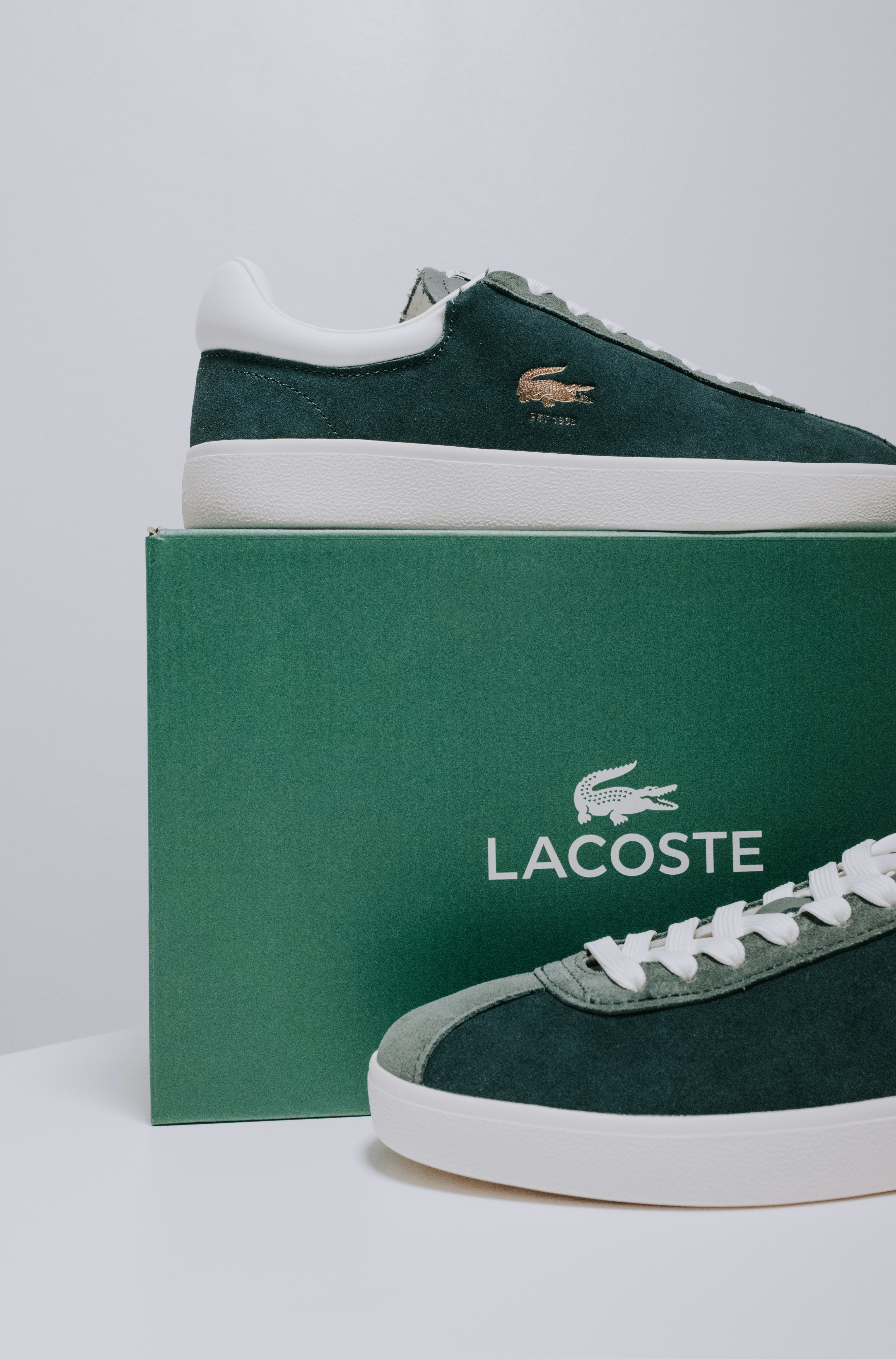 A pair of lacoste sneakers in a box photo – Free Grey Image on Unsplash